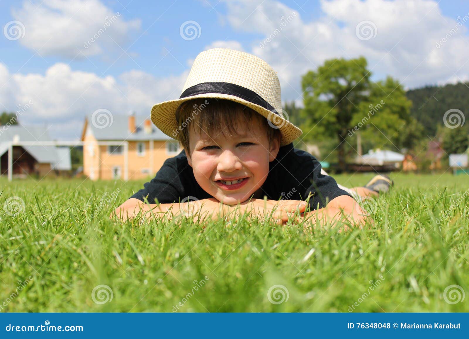 Little Boy Lying on a Green Grass Stock Photo - Image of garden ...