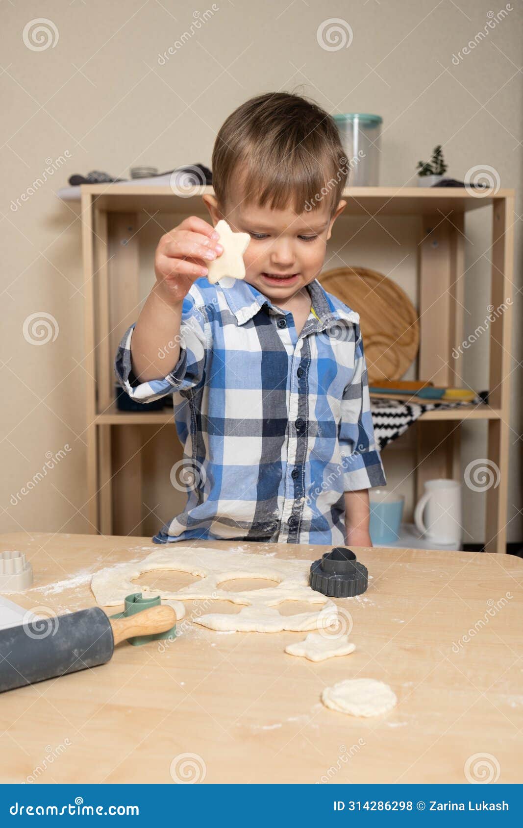 Little Boy Making Cookies Using Cookie Cutters and Dough in the Kitchen ...