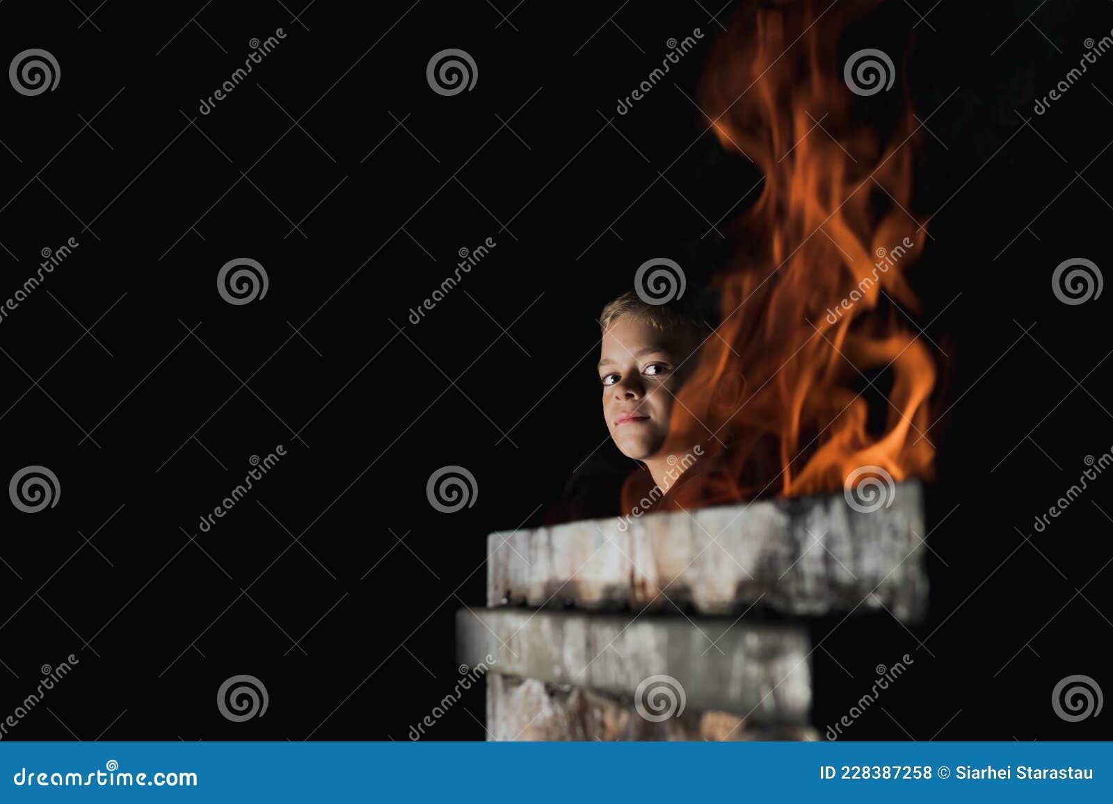 A Little Boy Near the Fire in the Dark Stock Photo - Image of mother ...