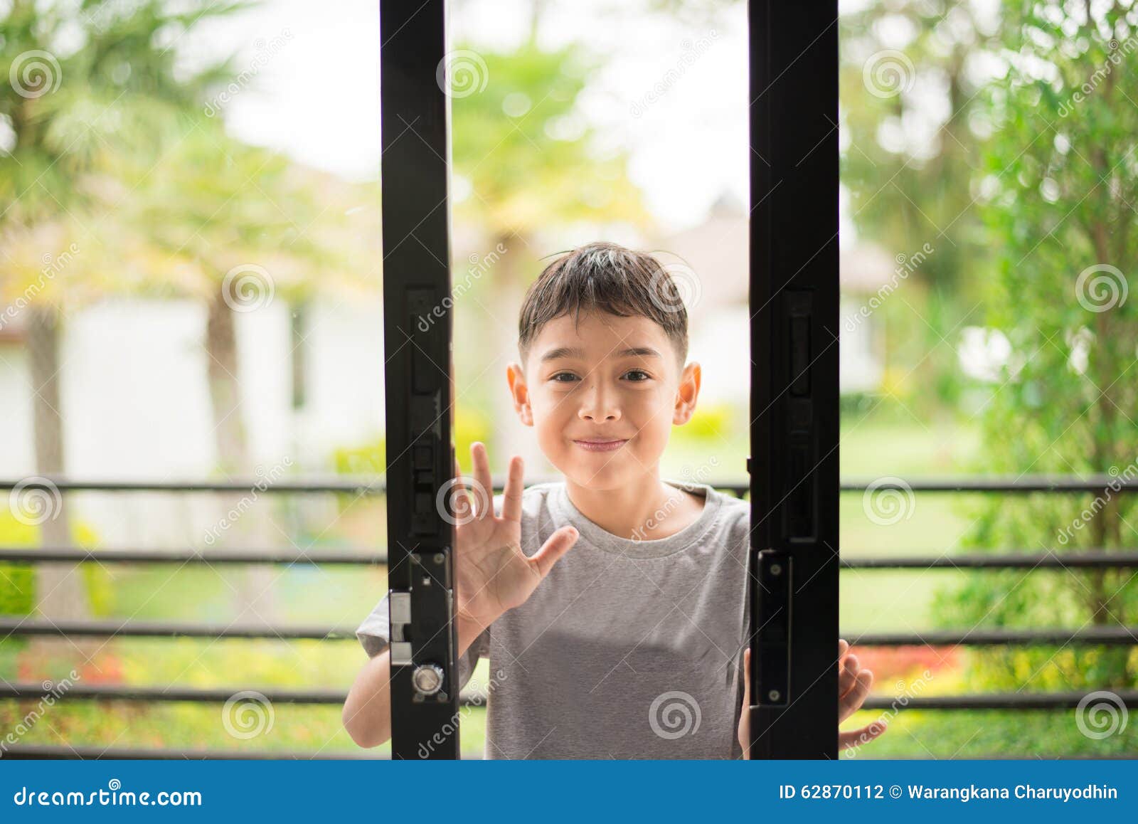 Little Boy Opening Door into the House Stock Photo - Image of childhood ...