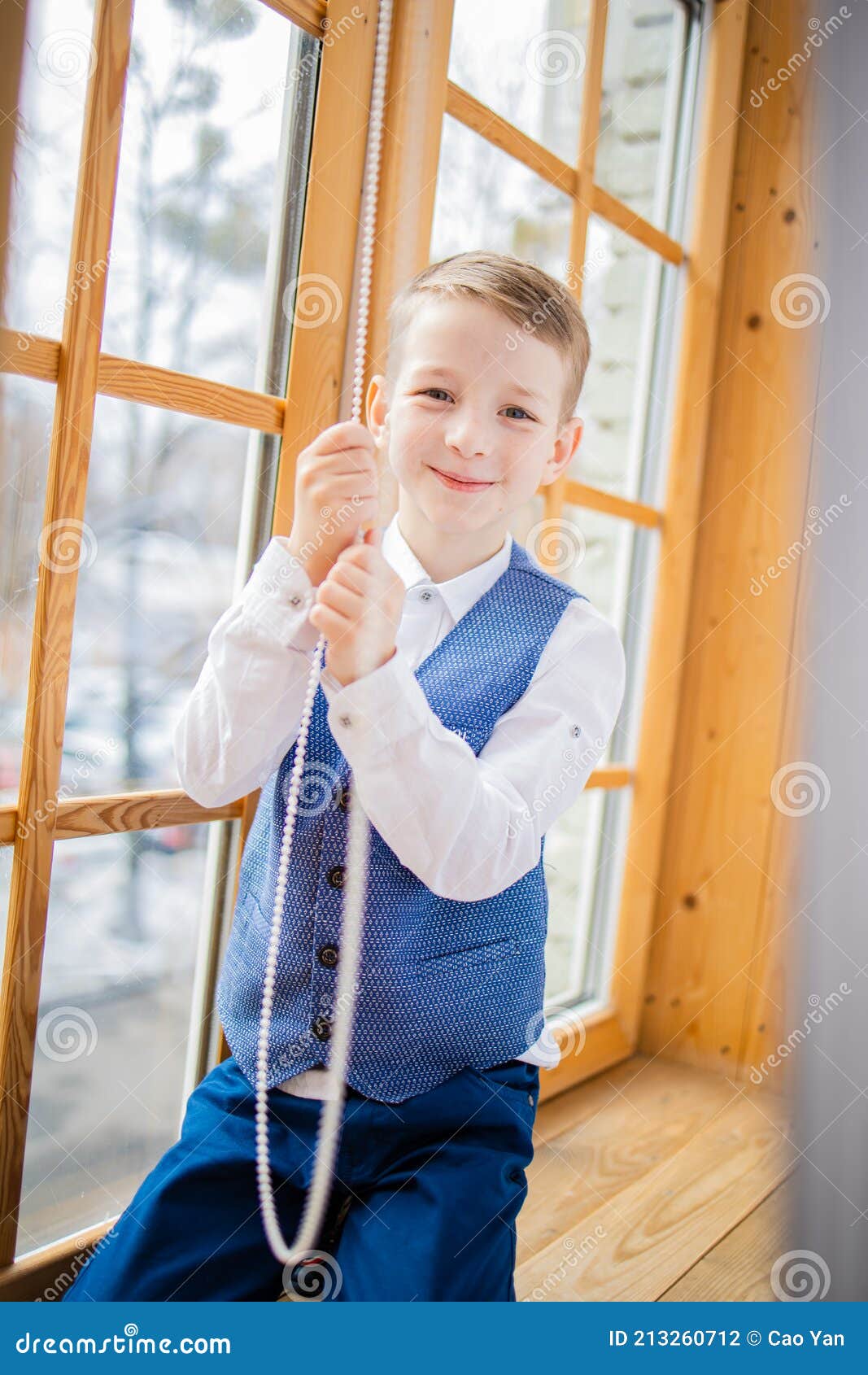 A Little Boy Opens the Blinds of a Large Window in a New Apartment ...