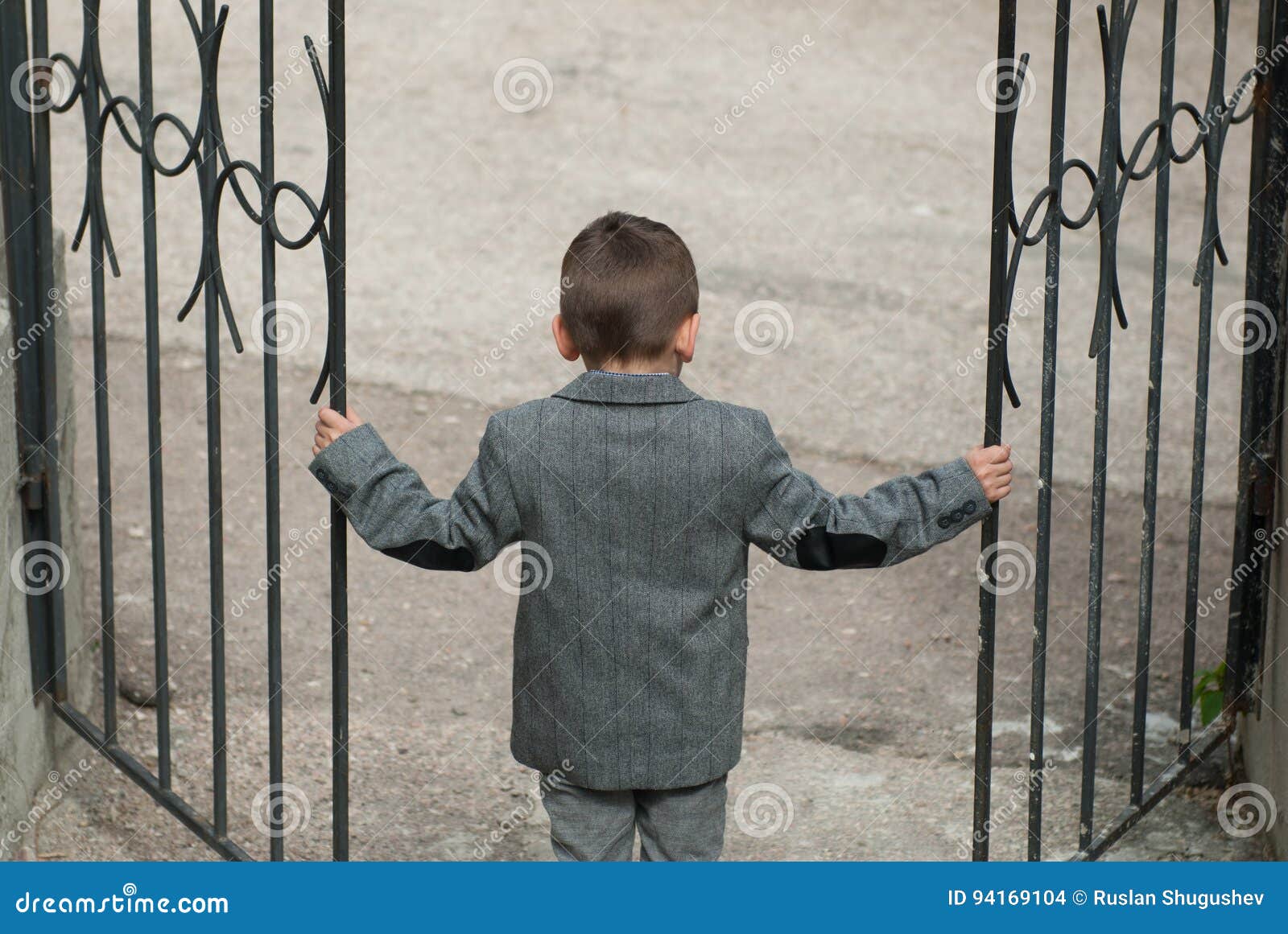 Little Boy Opens a Wrought-iron Gate Stock Photo - Image of resolve ...
