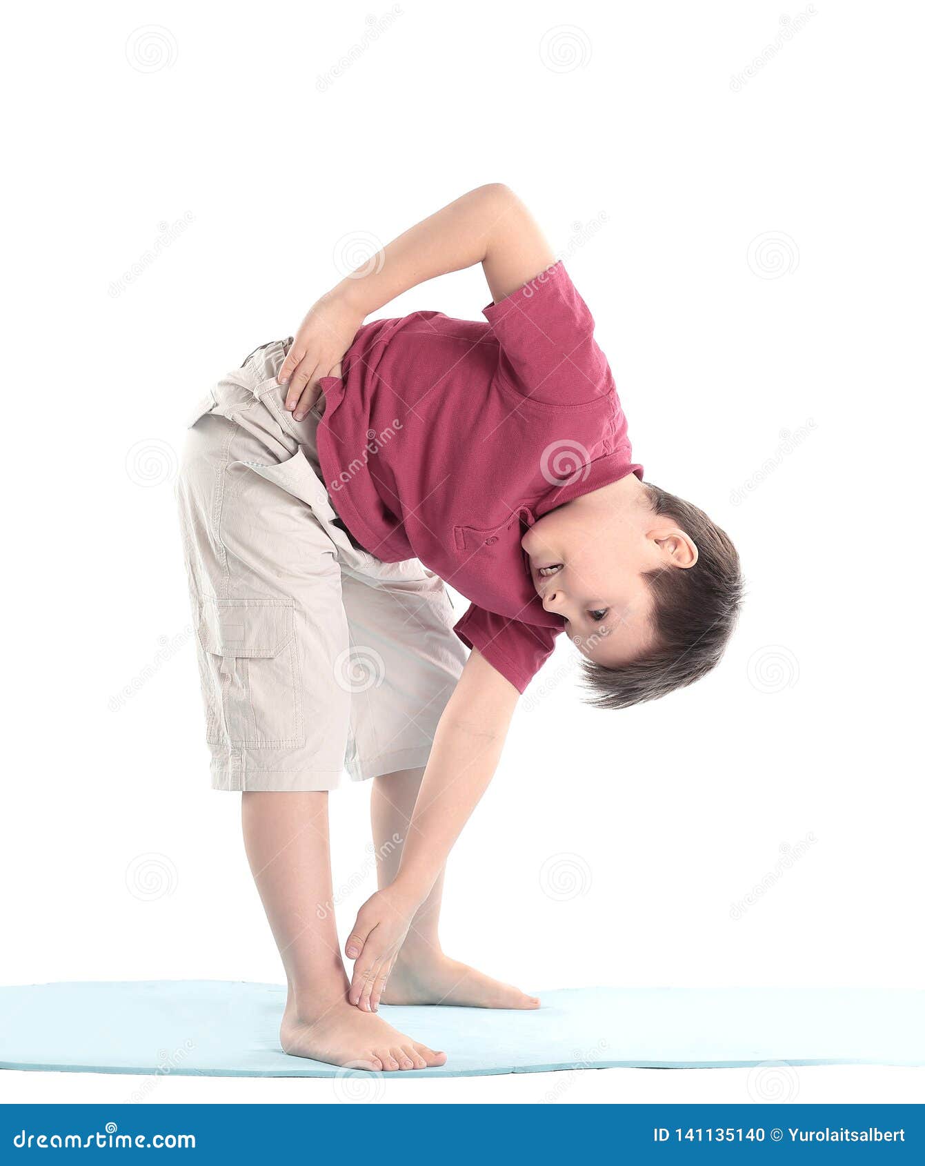 Little Boy Performs an Exercise To Stretch the Muscles.isolated on ...