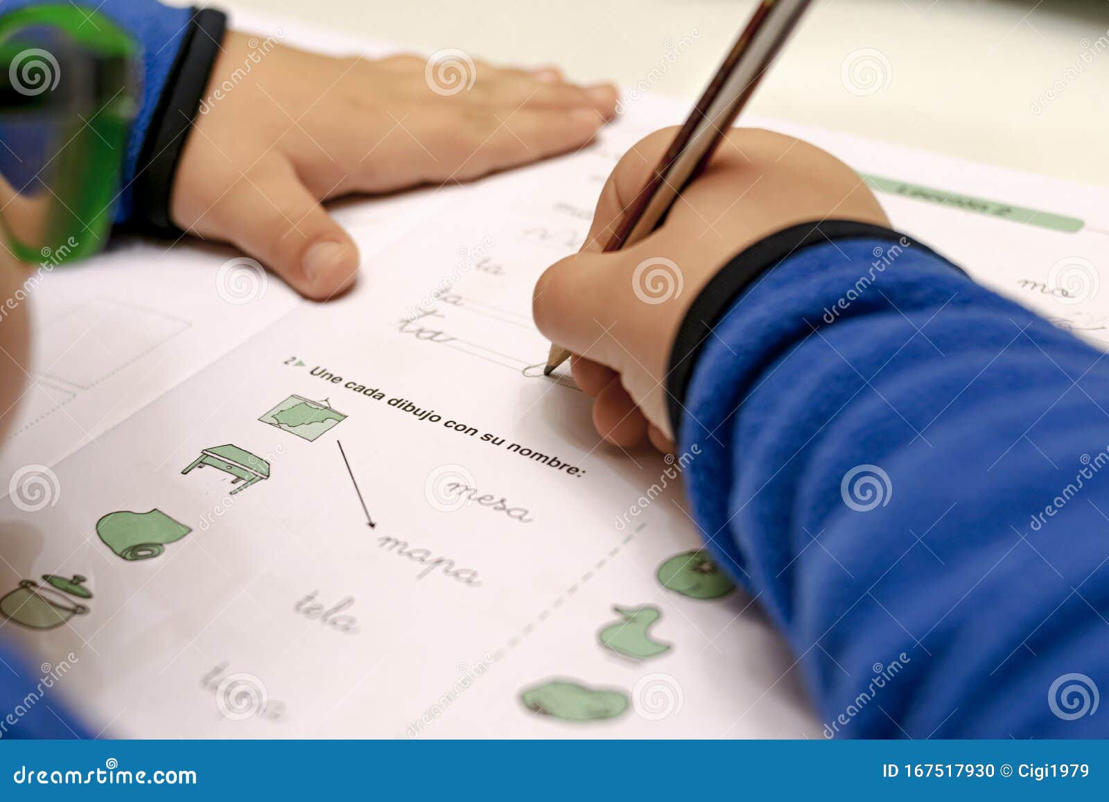 Little Boy Performs Homework with a Pencil, Learning To Write Stock ...