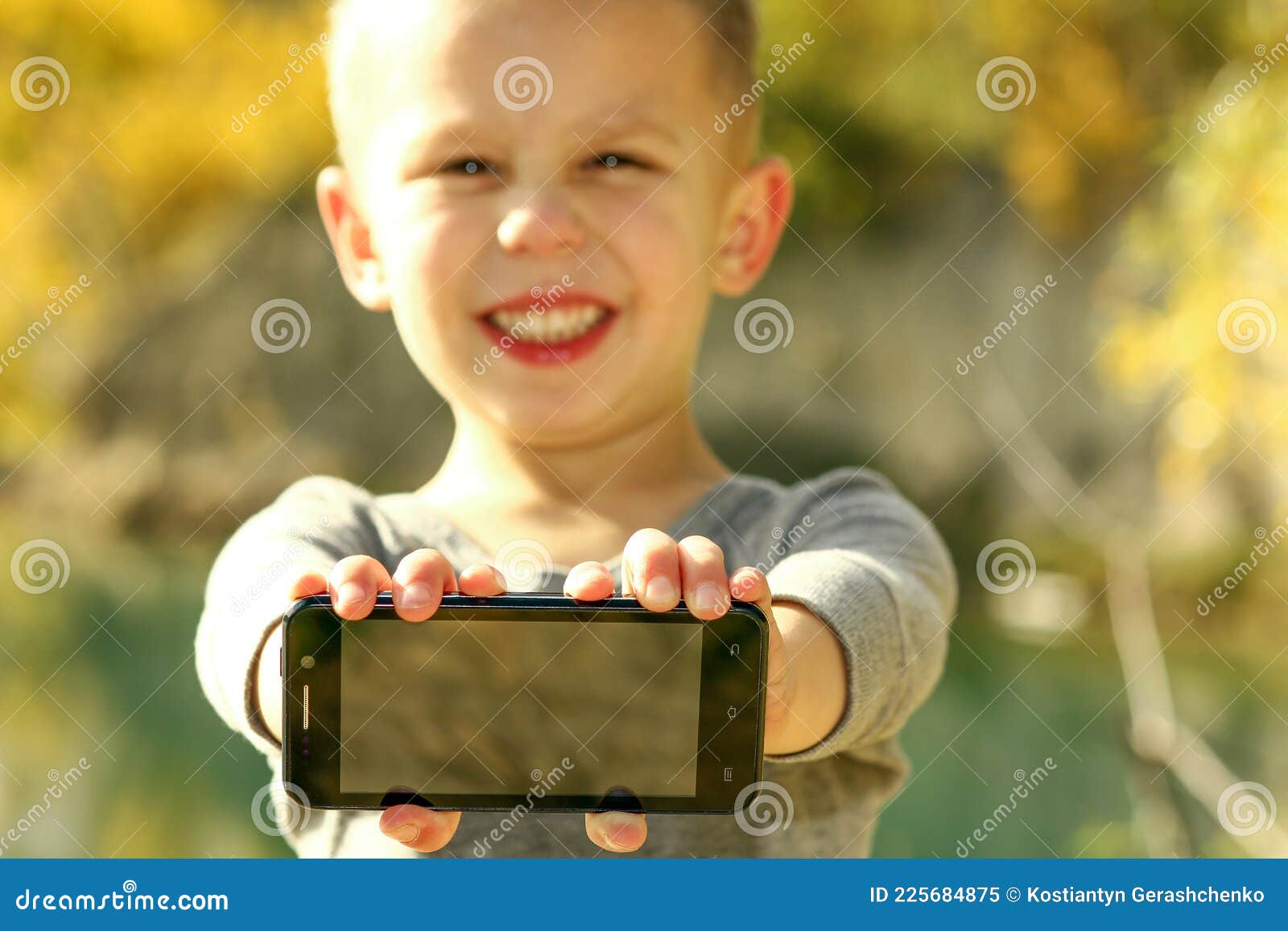 Little boy with phone stock image. Image of play, mobile - 225684875