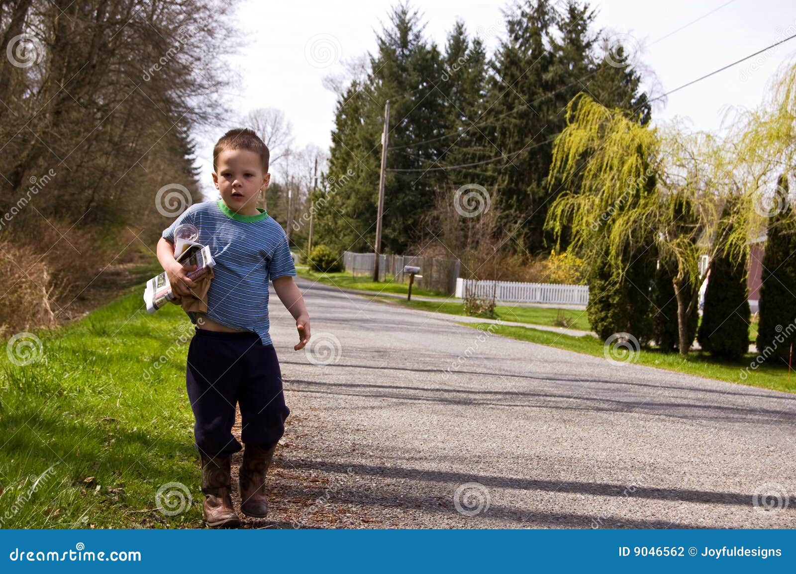 Little Boy Picking Up Litter on Roadside Stock Photo - Image of ...