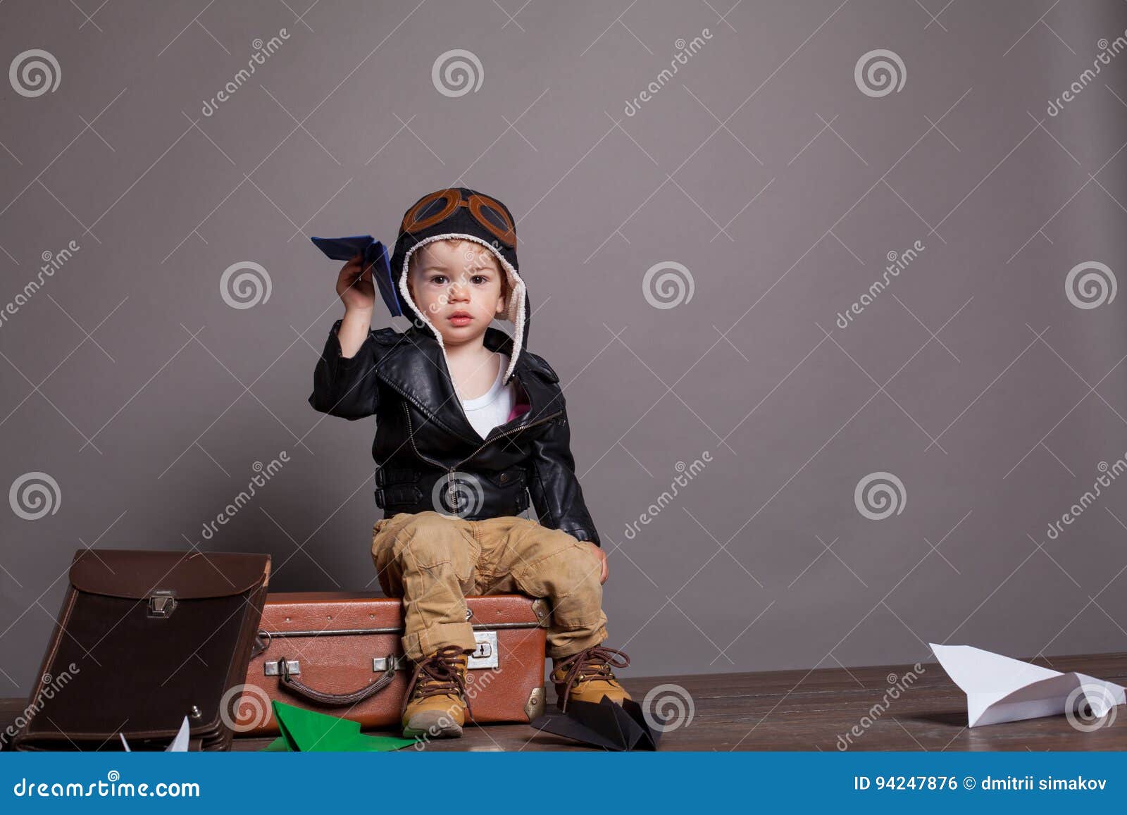 Little Boy Pilot Plays in the Paper Plane Stock Photo - Image of paper ...