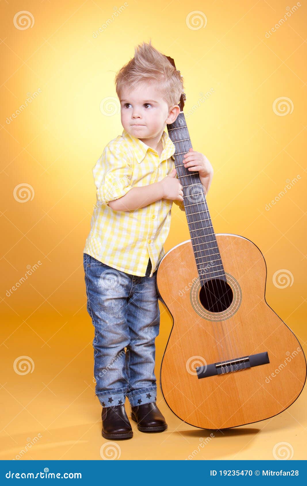 Little boy play the guitar stock photo. Image of rock - 19235470