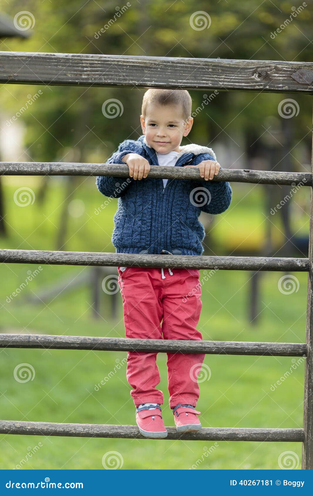 Little boy at playground stock image. Image of action - 40267181
