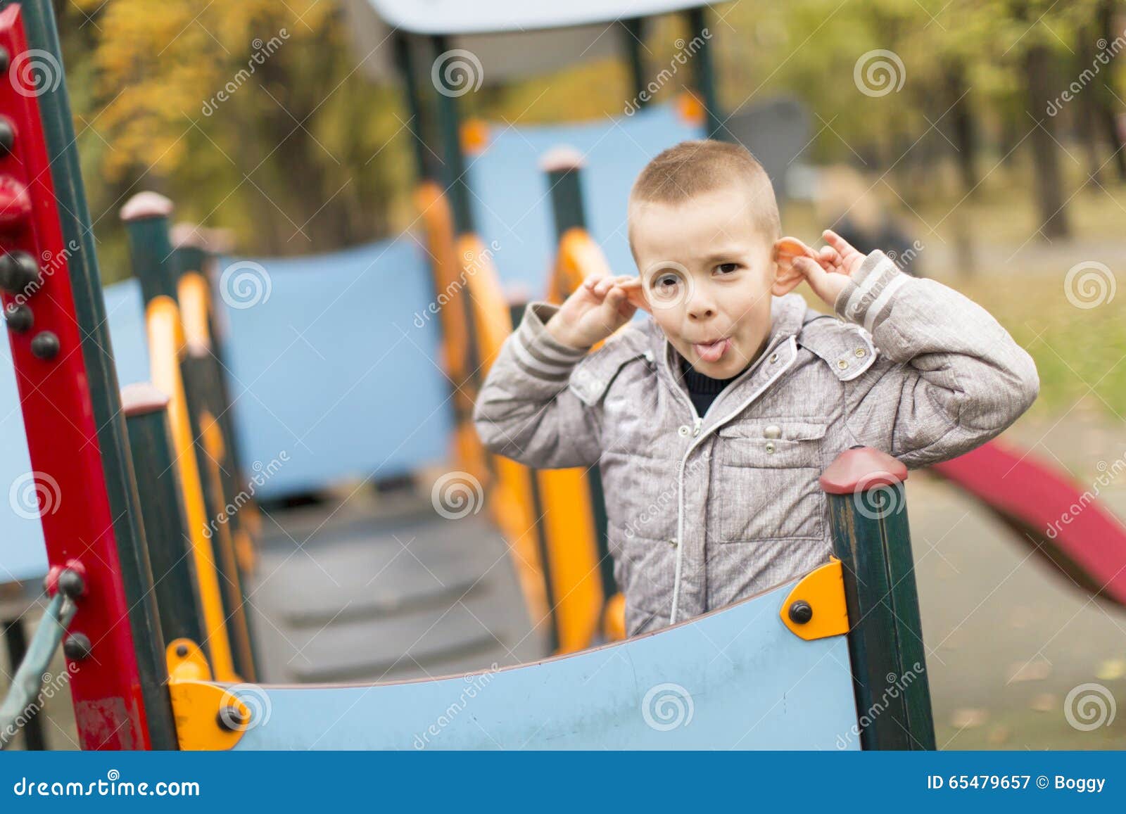 Little boy at playground stock image. Image of smile - 65479657