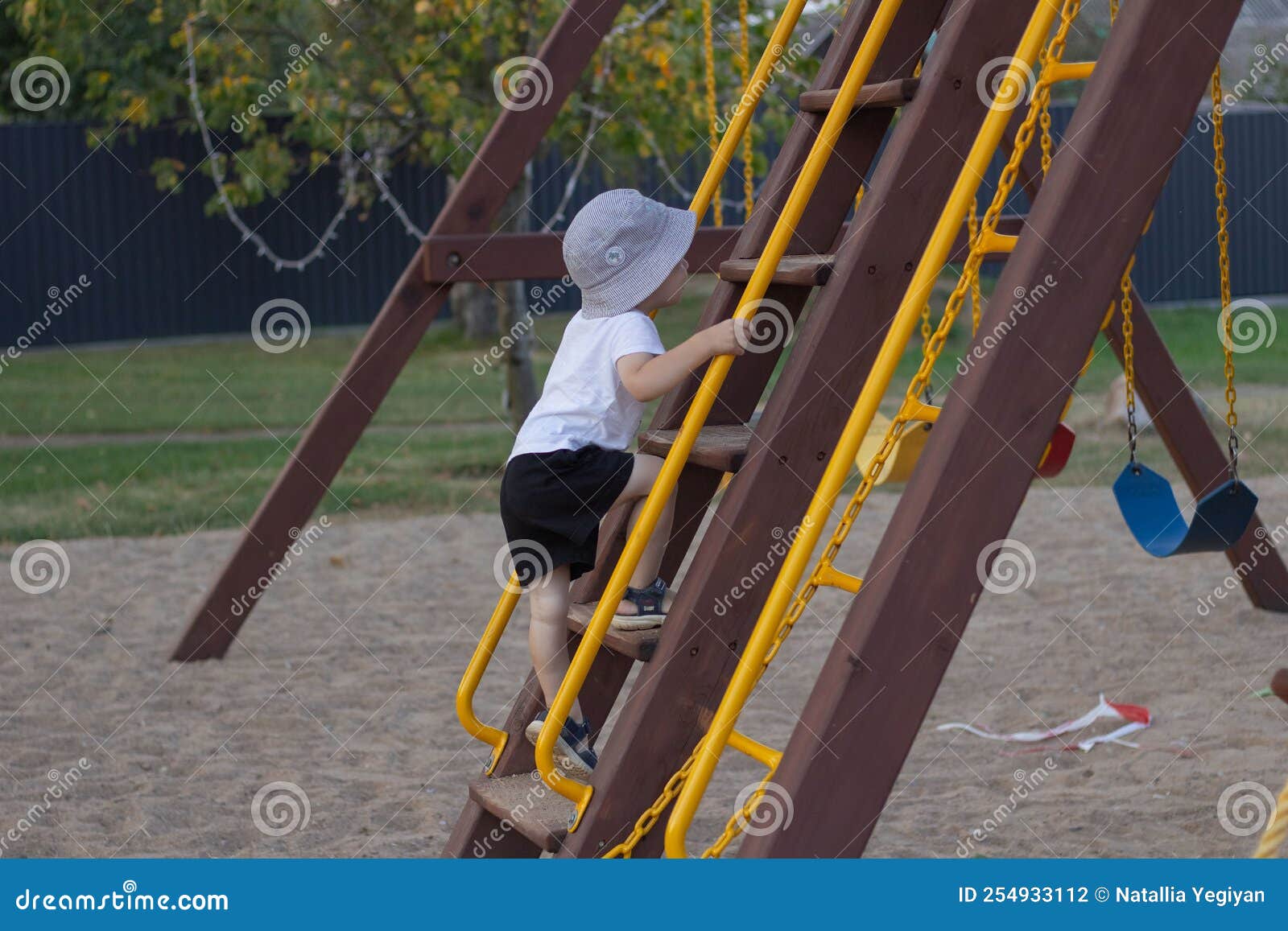 A Little Boy on the Playground Stock Photo - Image of person, looking ...