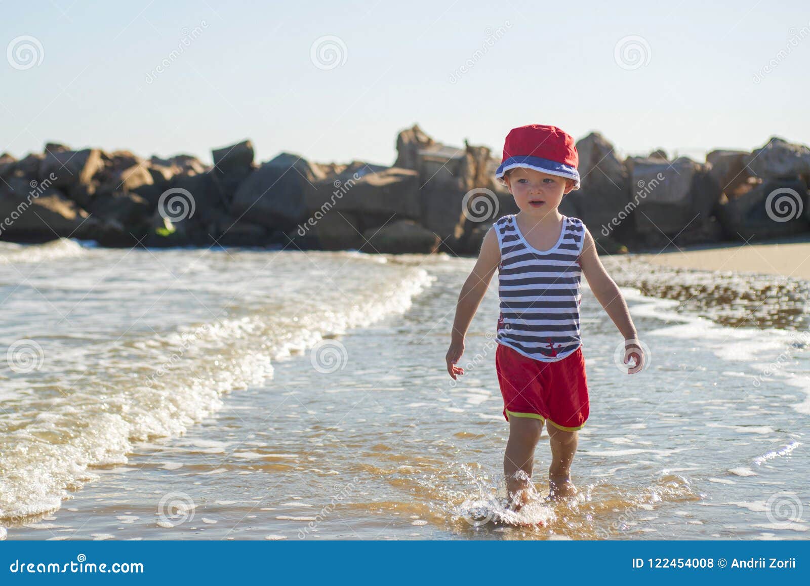 Little Boy Playing on the Beach. Stock Photo - Image of childhood ...