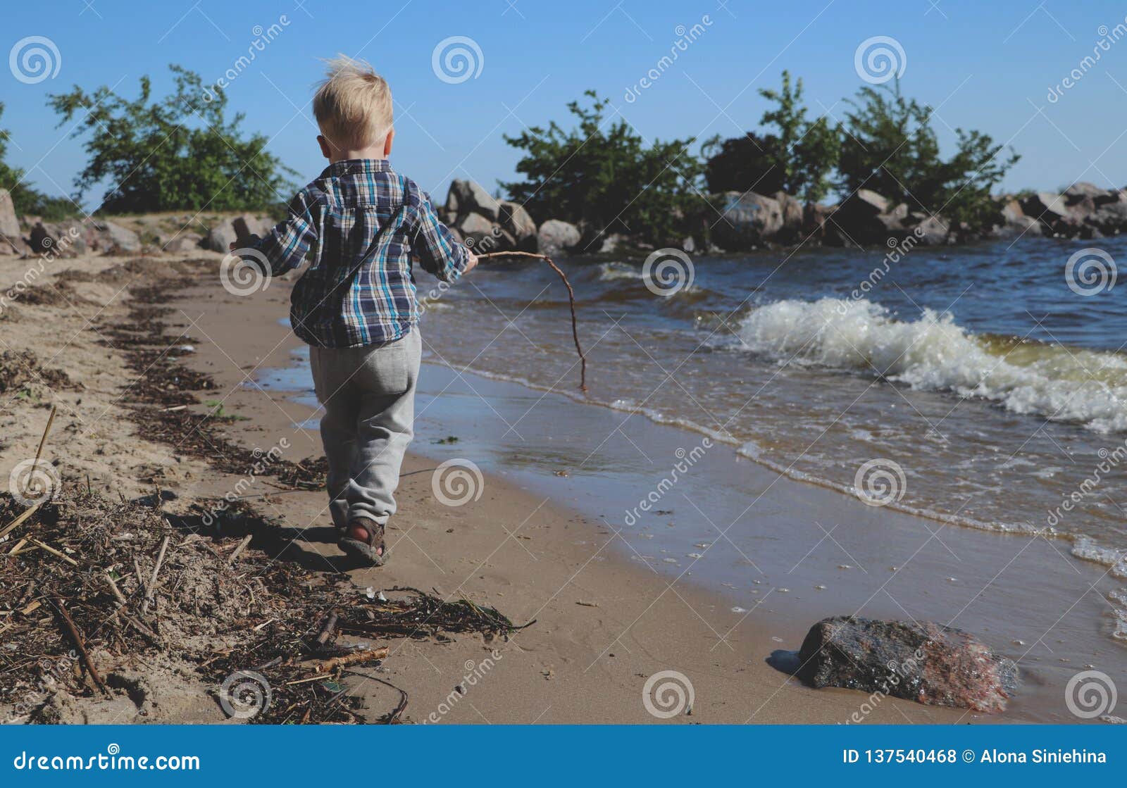 Little Boy Playing on the Beach Stock Photo - Image of cute, blue ...