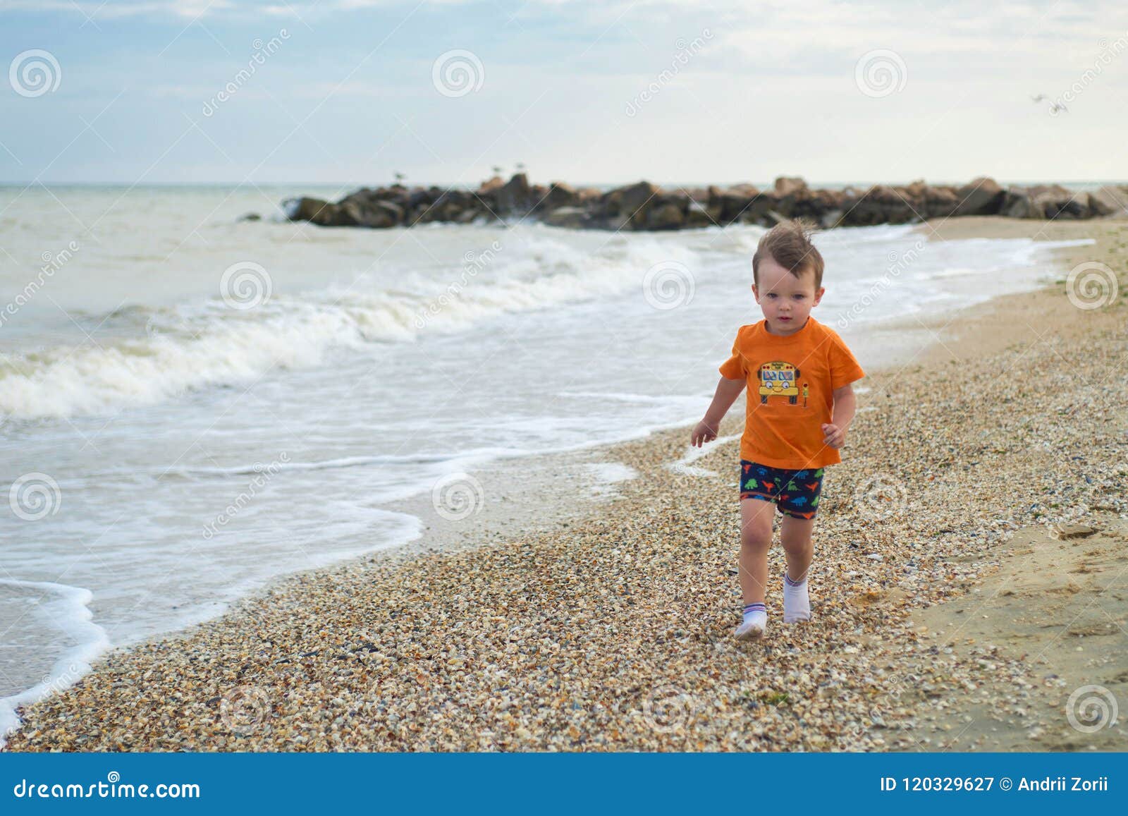 Little Boy Playing on the Beach. Stock Image - Image of coastline ...