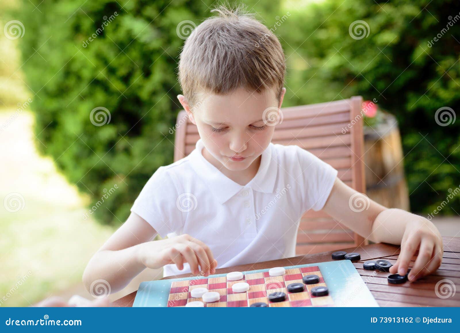 Little Boy Playing Checkers Board Game Stock Photo - Image of checkers ...