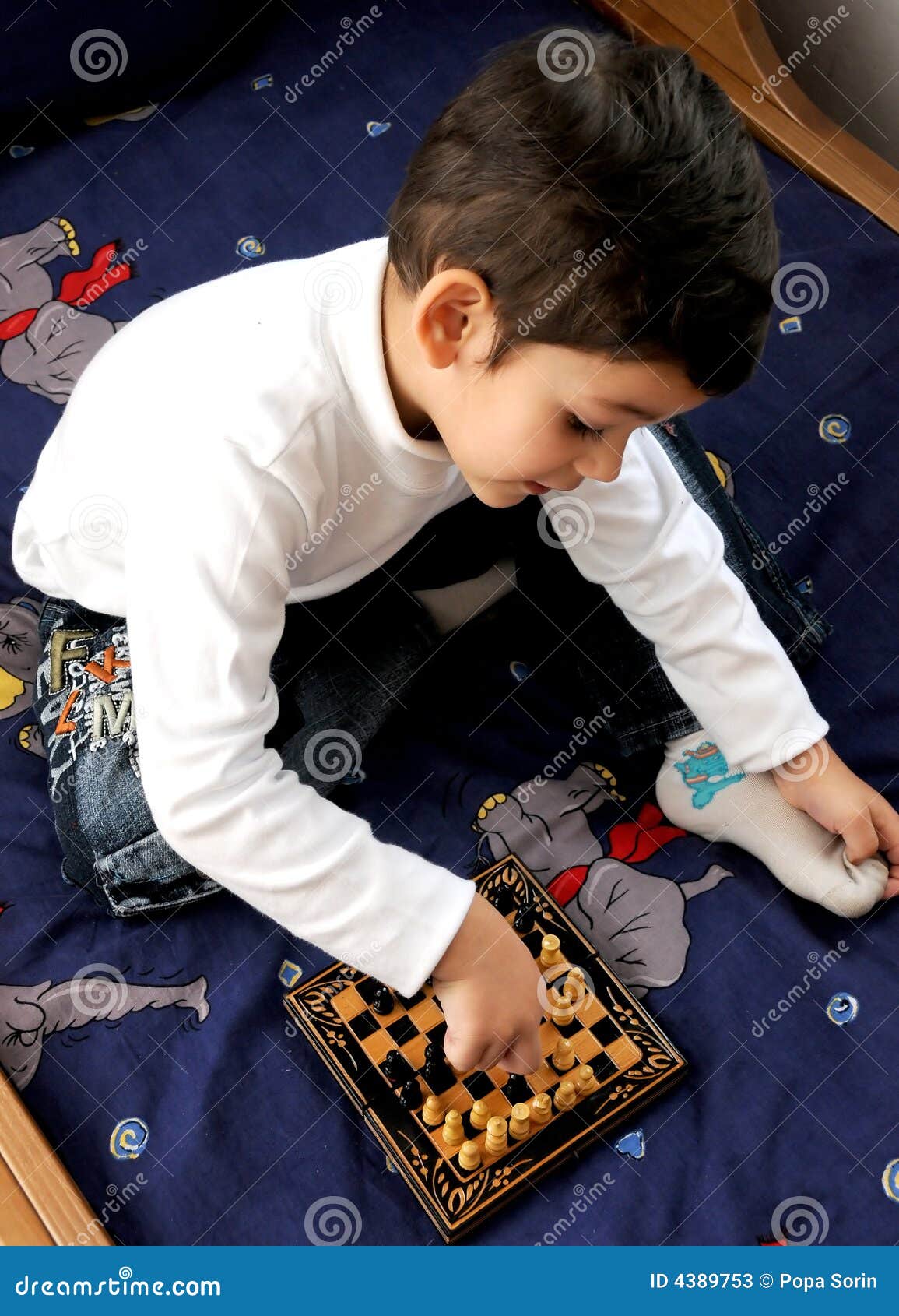 Little boy playing chess stock image. Image of game, activity - 4389753
