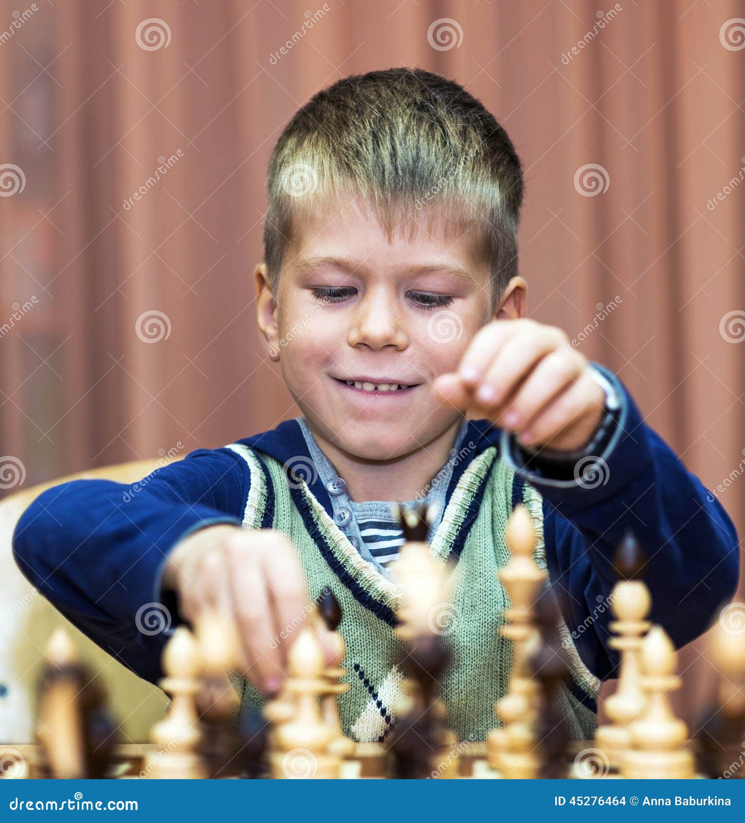Little boy playing chess stock photo. Image of junior - 45276464