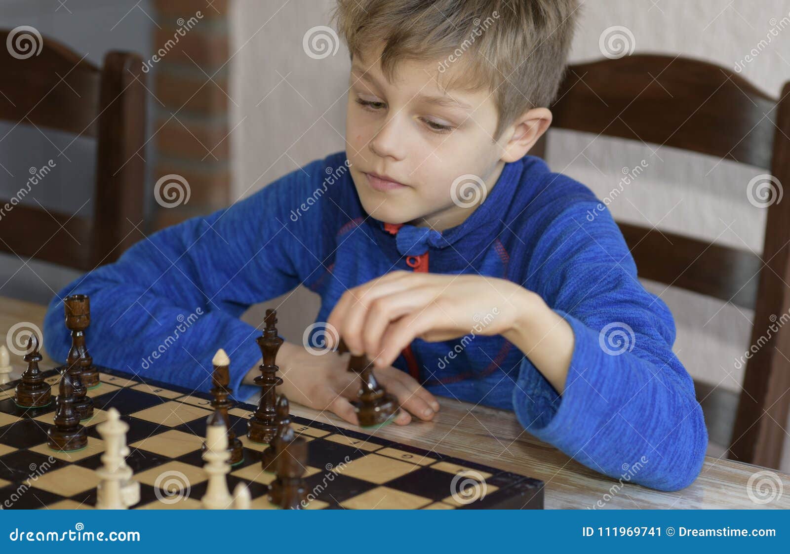 Little Boy is Playing Chess. Stock Image - Image of chess, games: 111969741