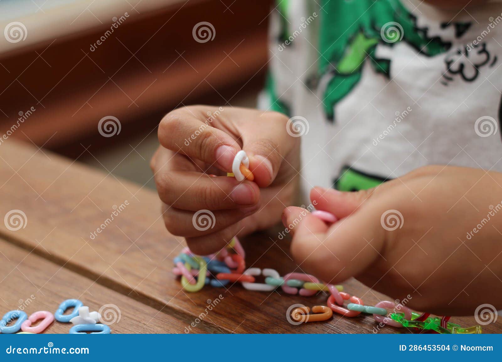 A Boy is Playing Plastic Chain Toy Stock Photo - Image of happy ...