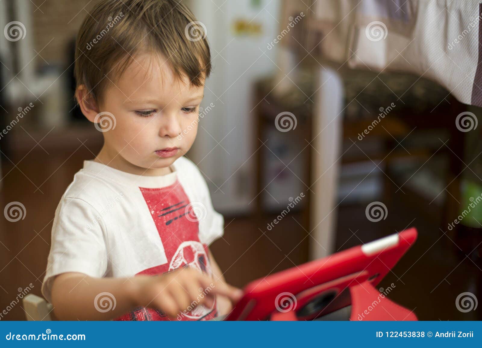 Little Boy Playing with Digital Tablet. Kid Using a Digital Tablet ...