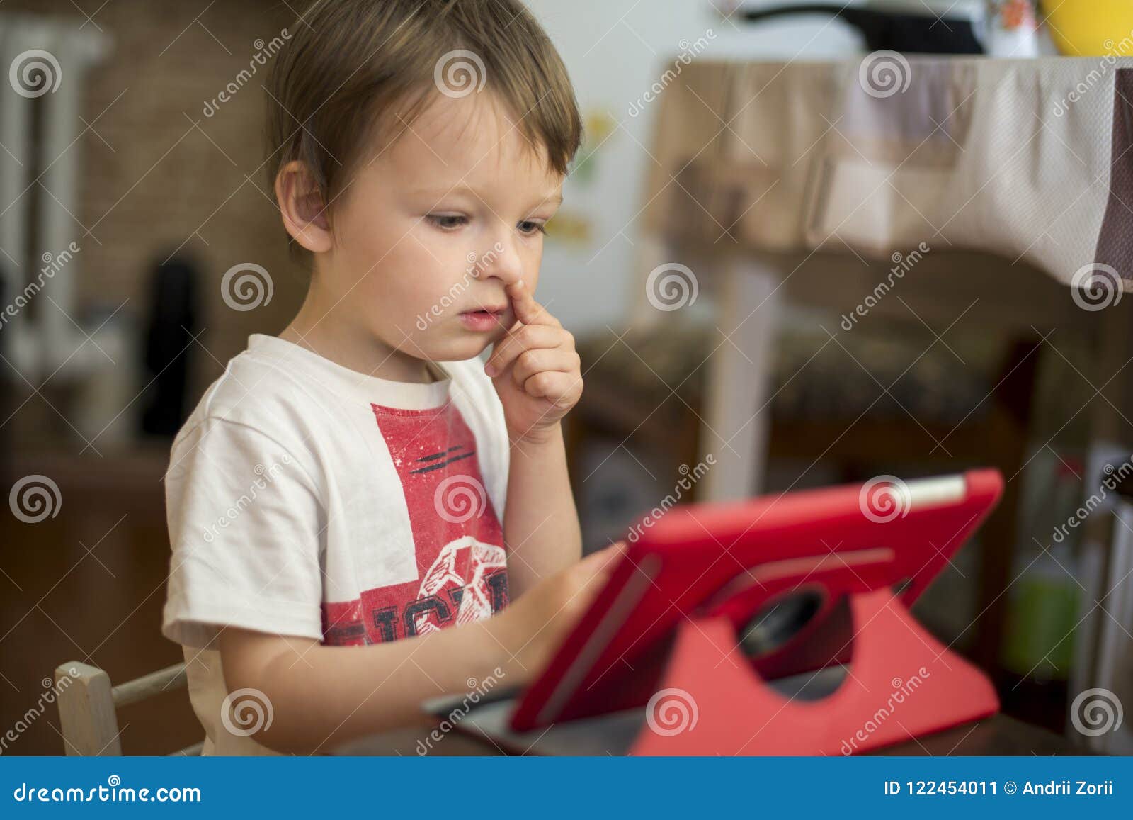 Little Boy Playing with Digital Tablet. Kid Using a Digital Tablet ...