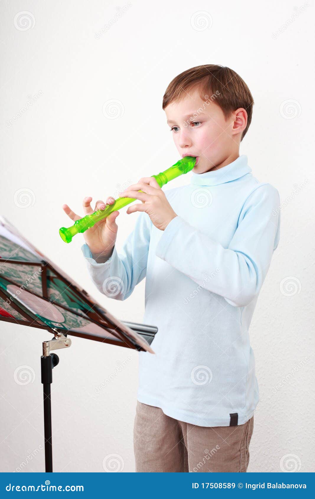 Little boy playing flute stock image. Image of children - 17508589