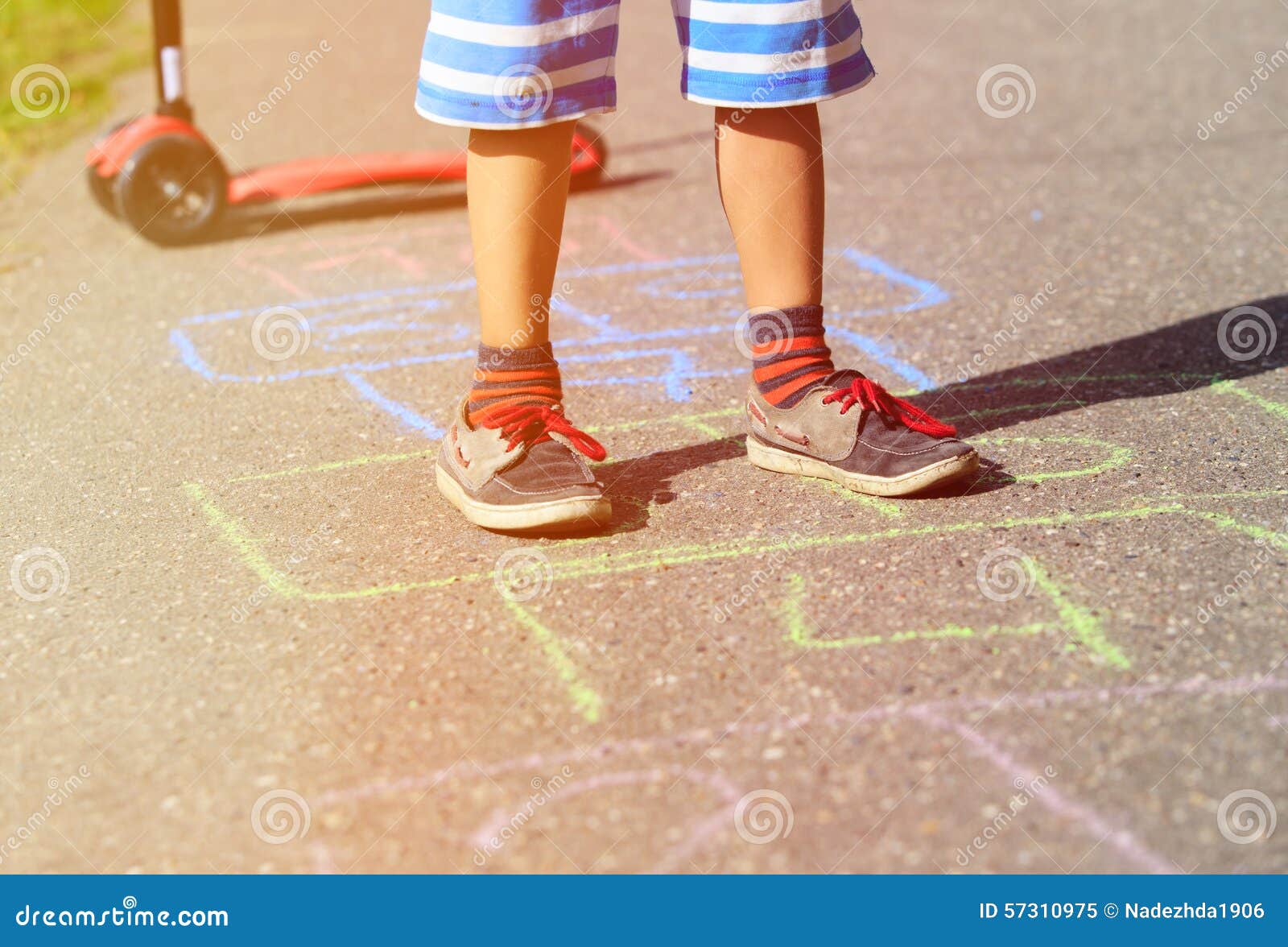 Little Boy Playing Hopscotch on Playground Stock Image - Image of ...