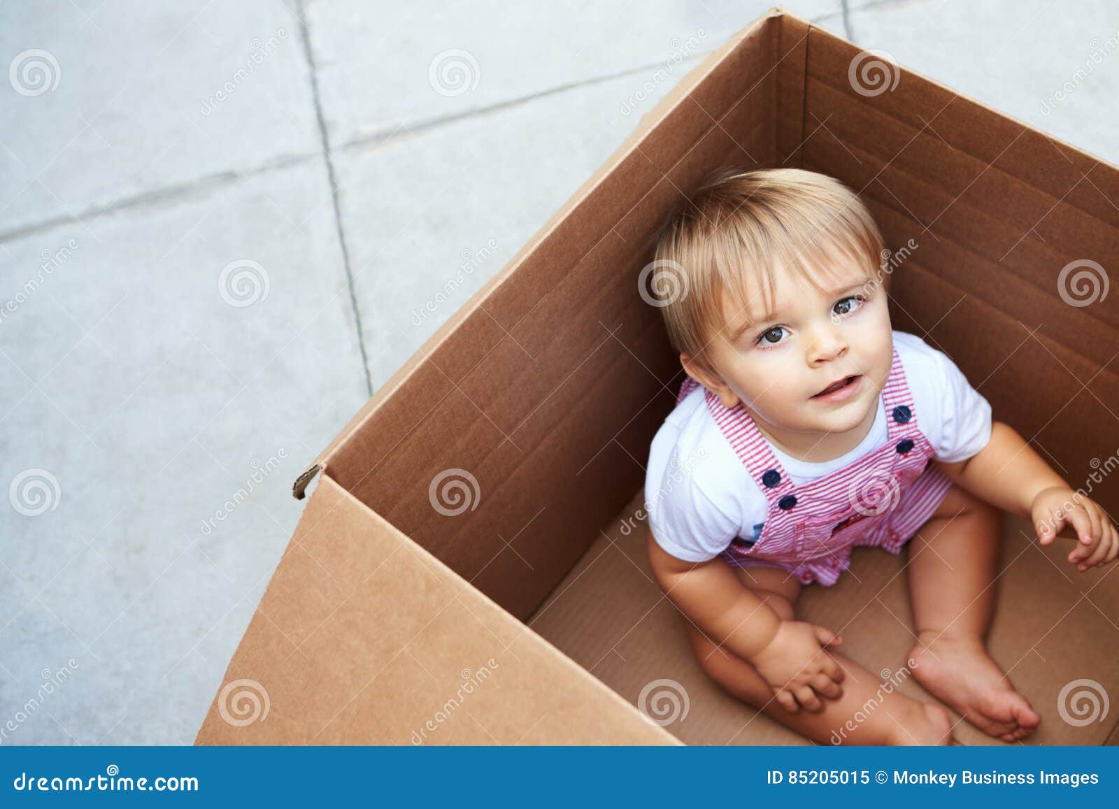 Little Boy Playing Inside Moving in Box Stock Image - Image of outdoors ...