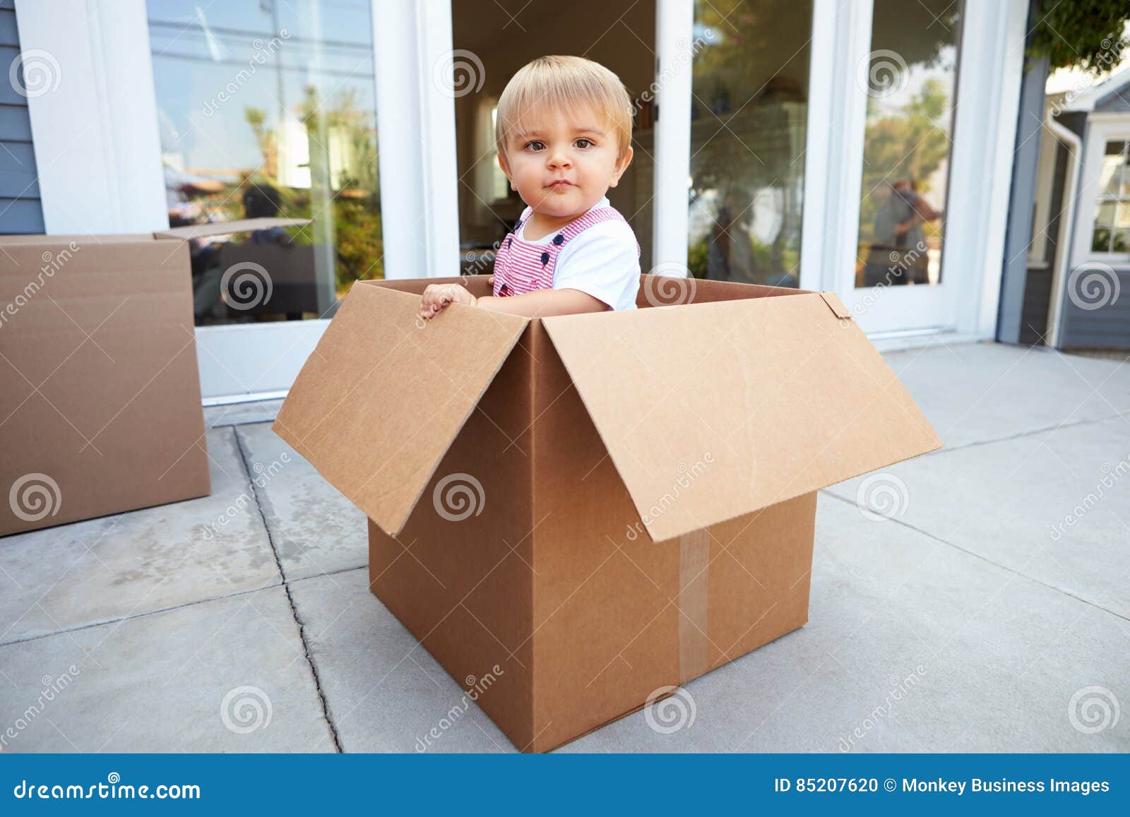 Little Boy Playing Inside Moving in Box Stock Photo - Image of hiding ...