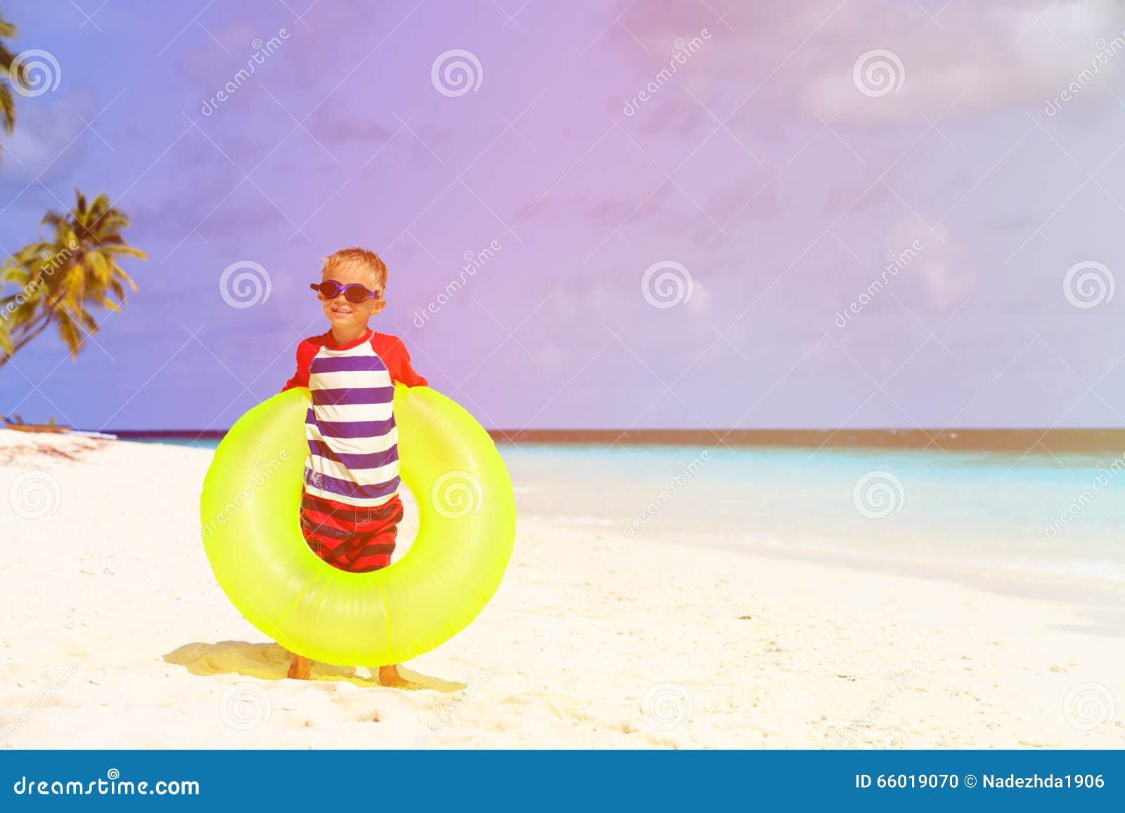 Little Boy Playing with Life Ring at Beach Stock Photo - Image of ...