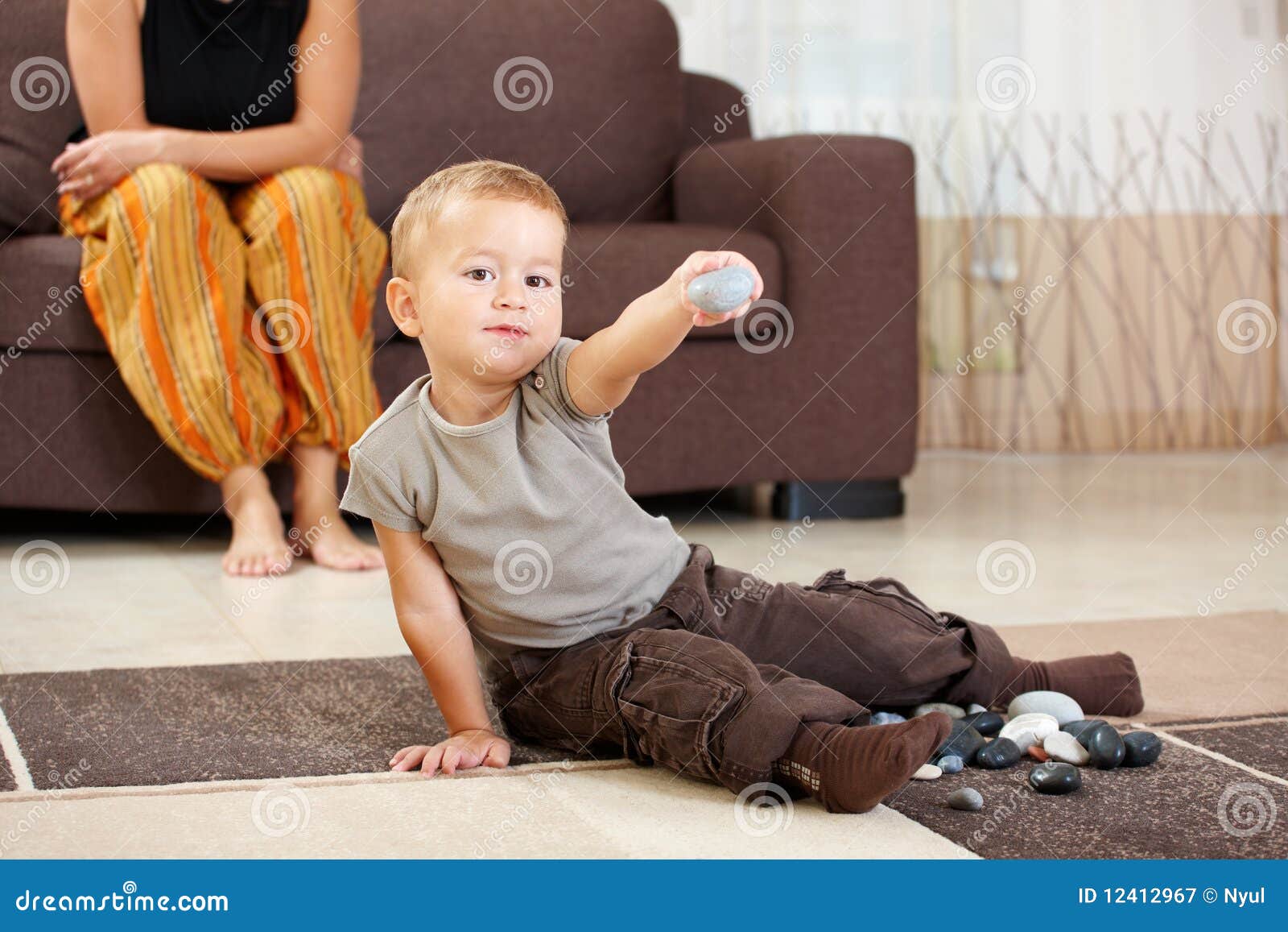Little Boy Playing with Pebbles Stock Image - Image of adorable, infant ...