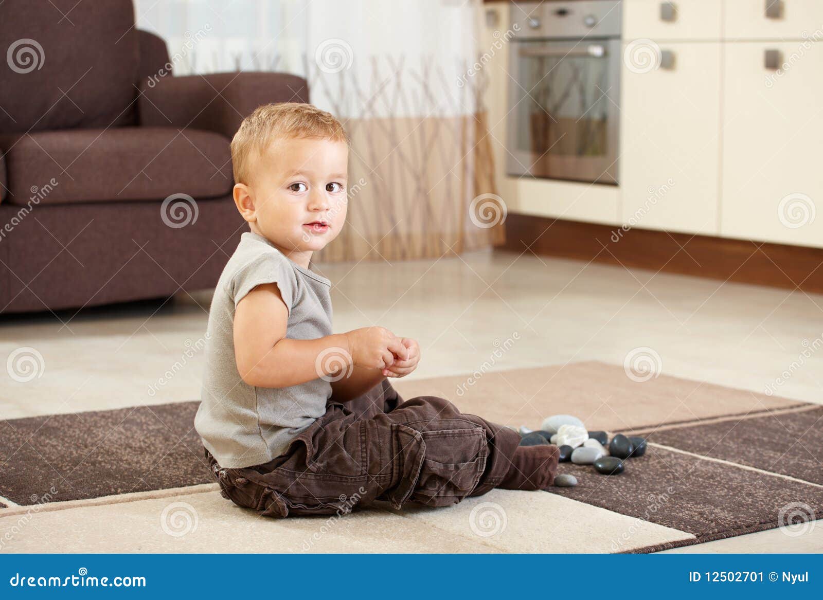 Little Boy Playing with Pebbles Stock Image - Image of child ...