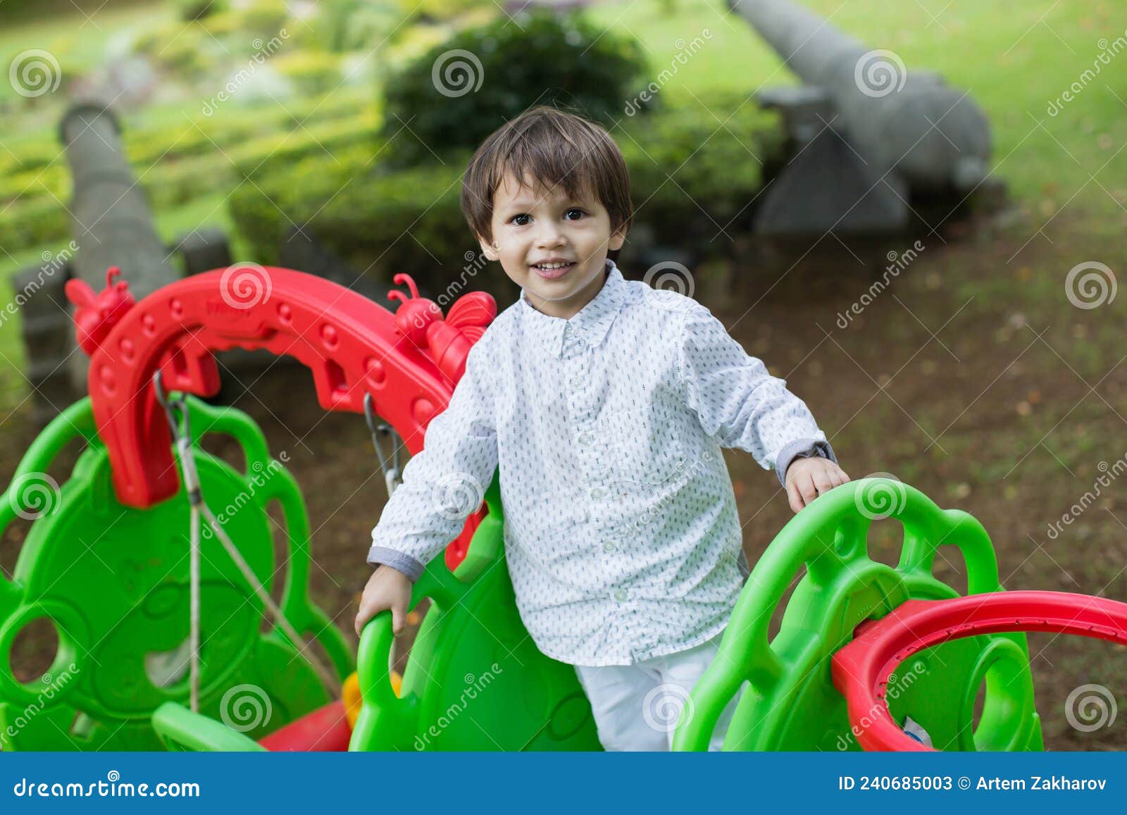 A Little Boy is Playing on the Playground Stock Image - Image of cute ...