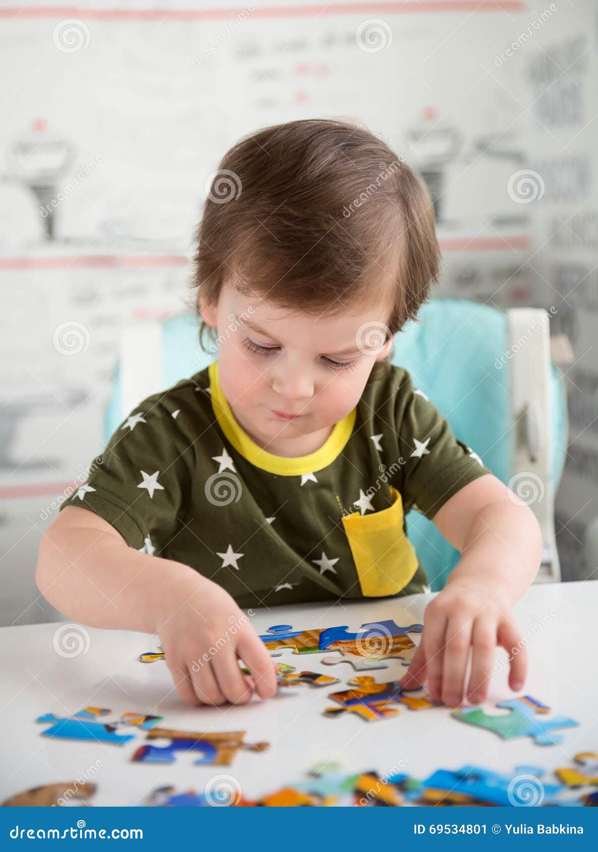 Little boy playing puzzle stock image. Image of development - 69534801