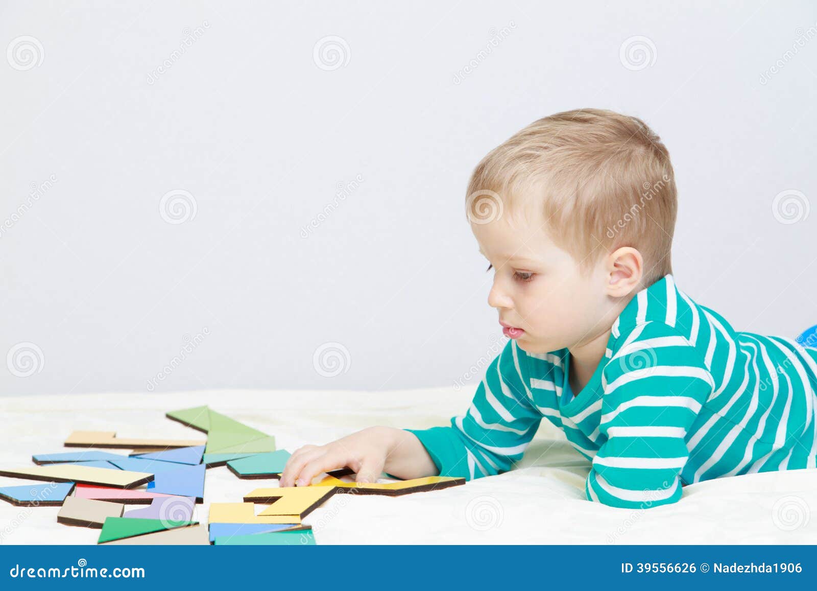 Little Boy Playing with Puzzle Stock Photo - Image of math, challenge ...