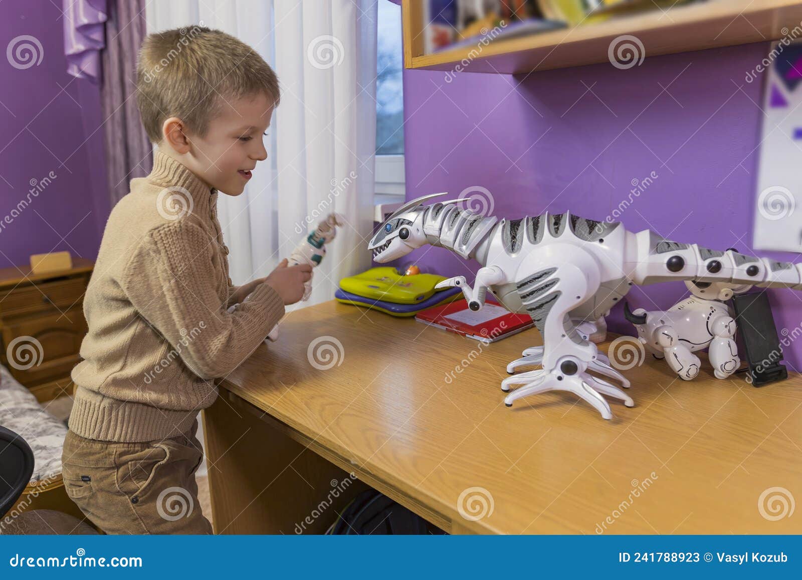 Little Boy Playing with Robots Stock Image - Image of colorful ...