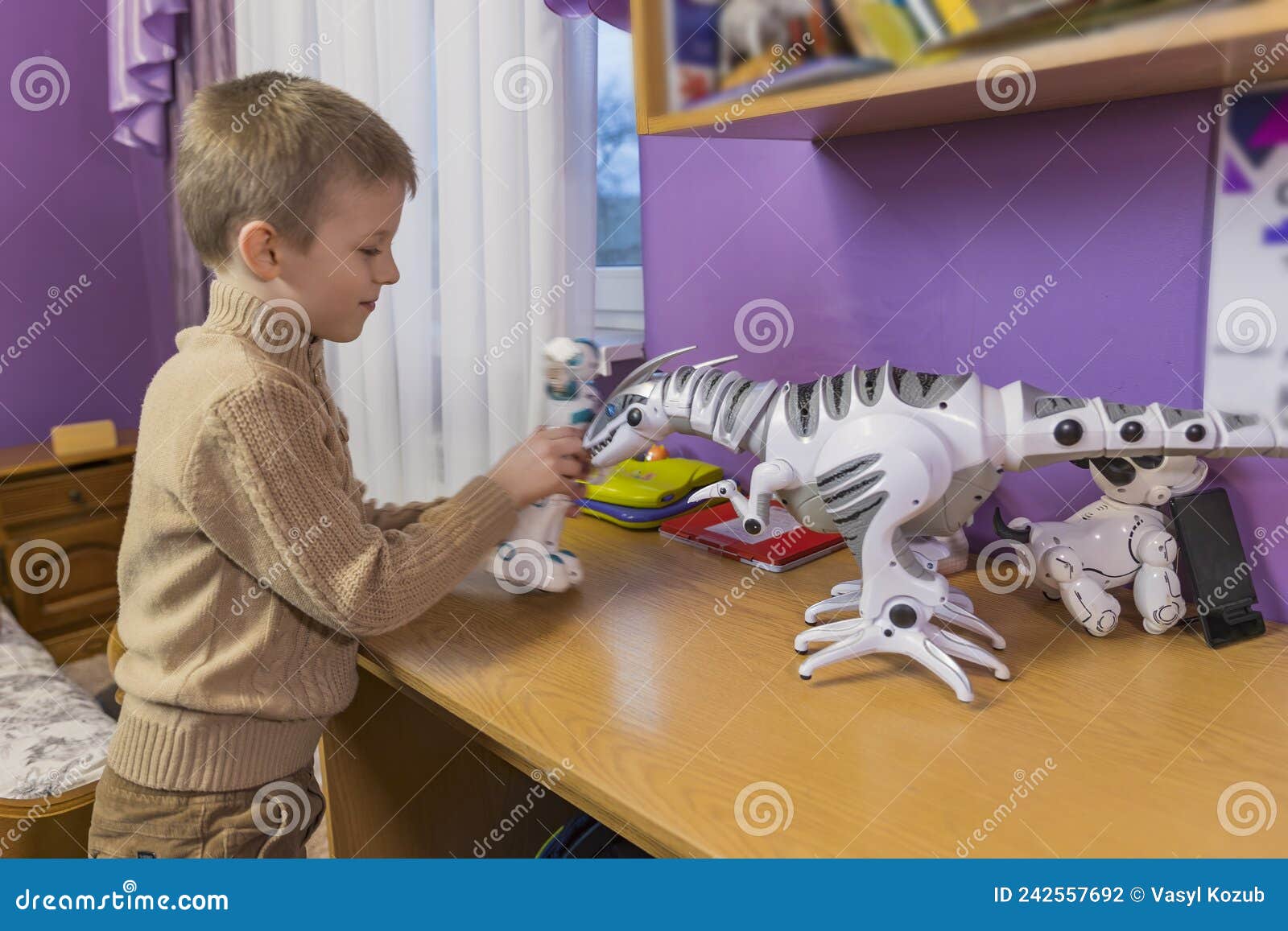 Little Boy Playing with Robots Stock Photo - Image of background, robot ...