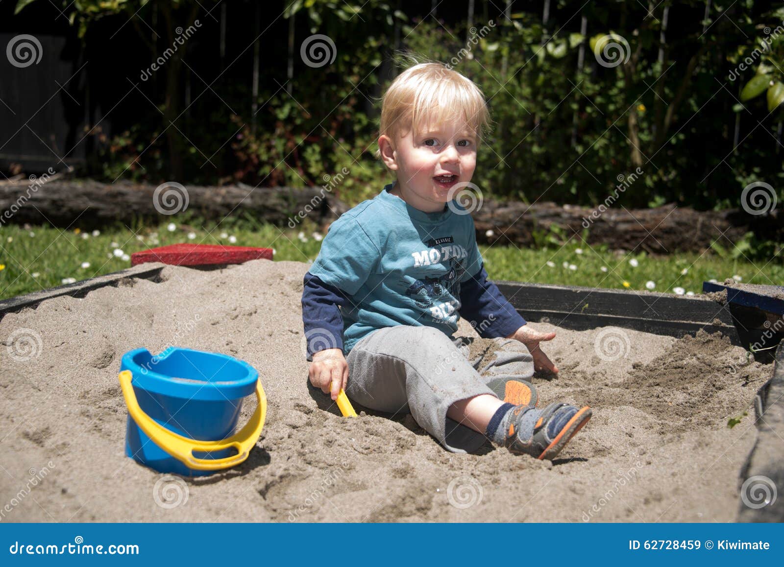 Little Boy Playing in a Sandbox Stock Image - Image of sitting, casual ...