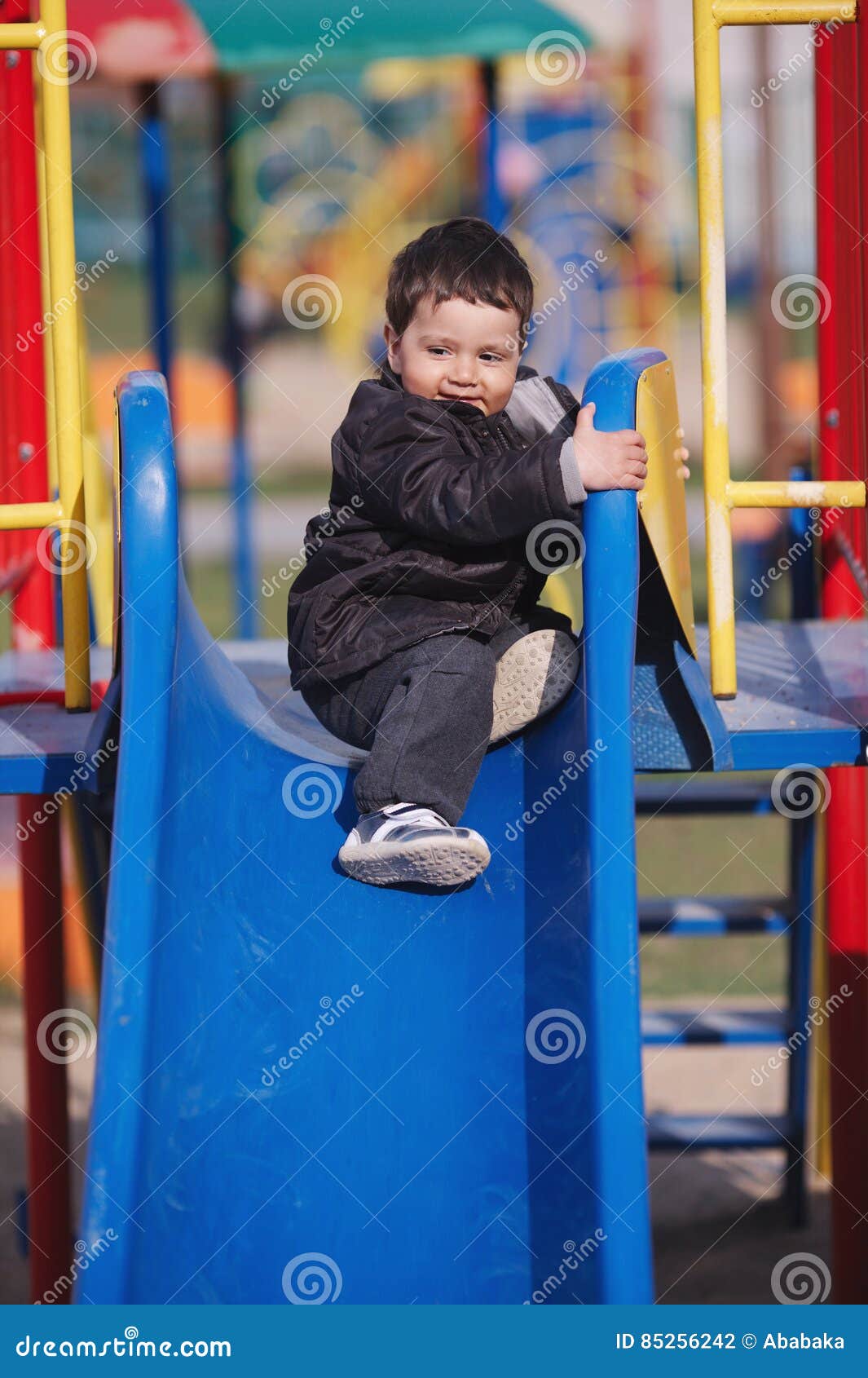 Little Boy Playing on Slide Stock Photo - Image of play, little: 85256242