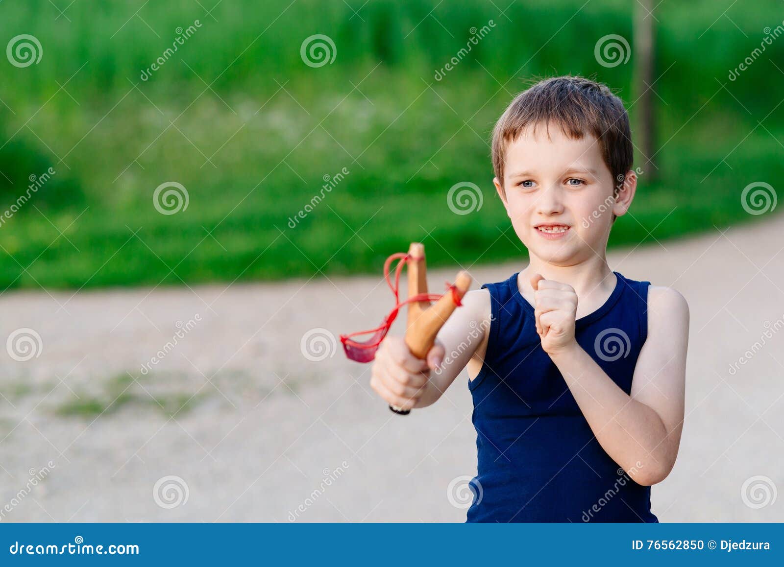 Little Boy Playing with Slingshot Stock Photo - Image of expression ...