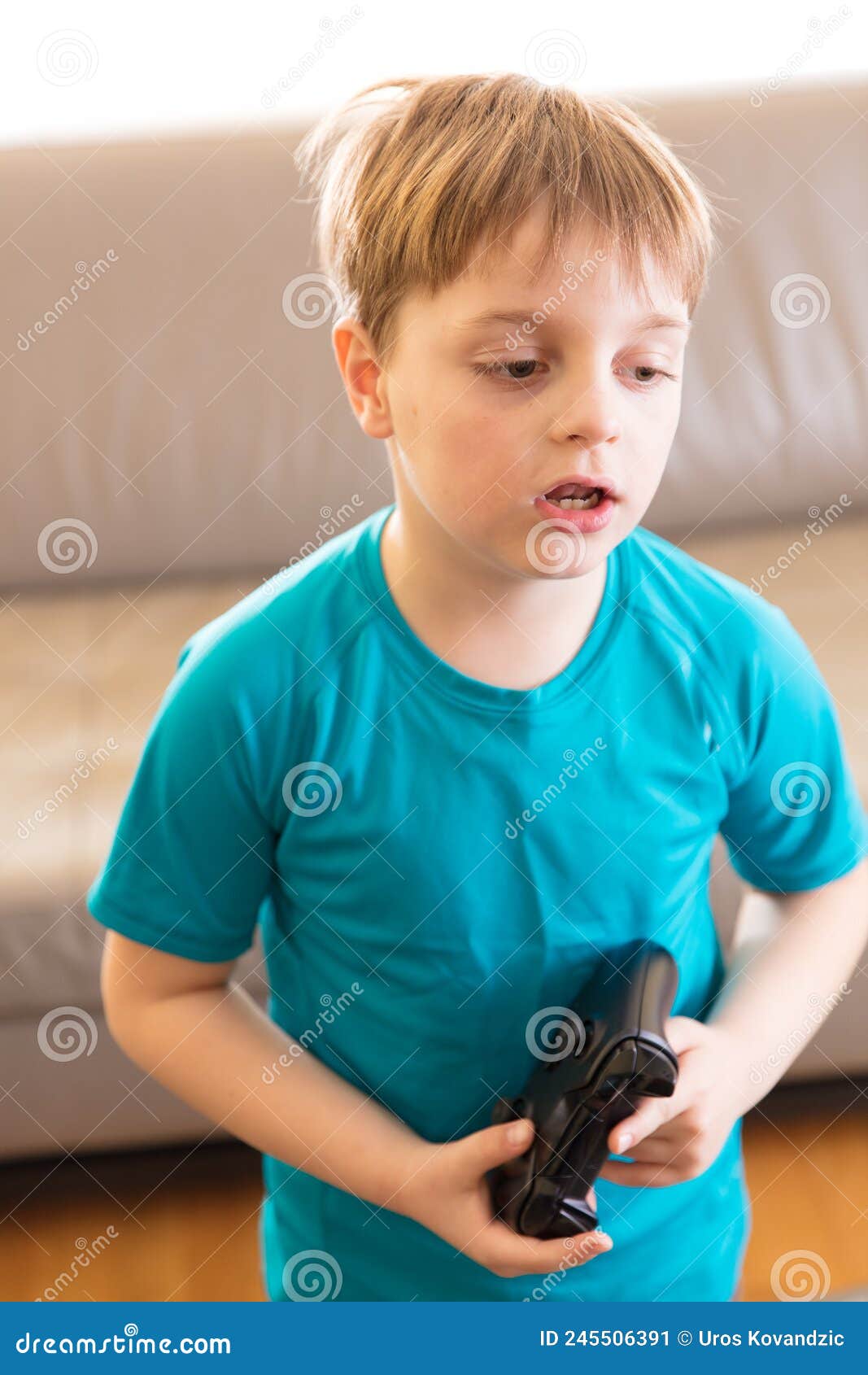 Boy playing video games stock image. Image of cute, childhood - 245506391