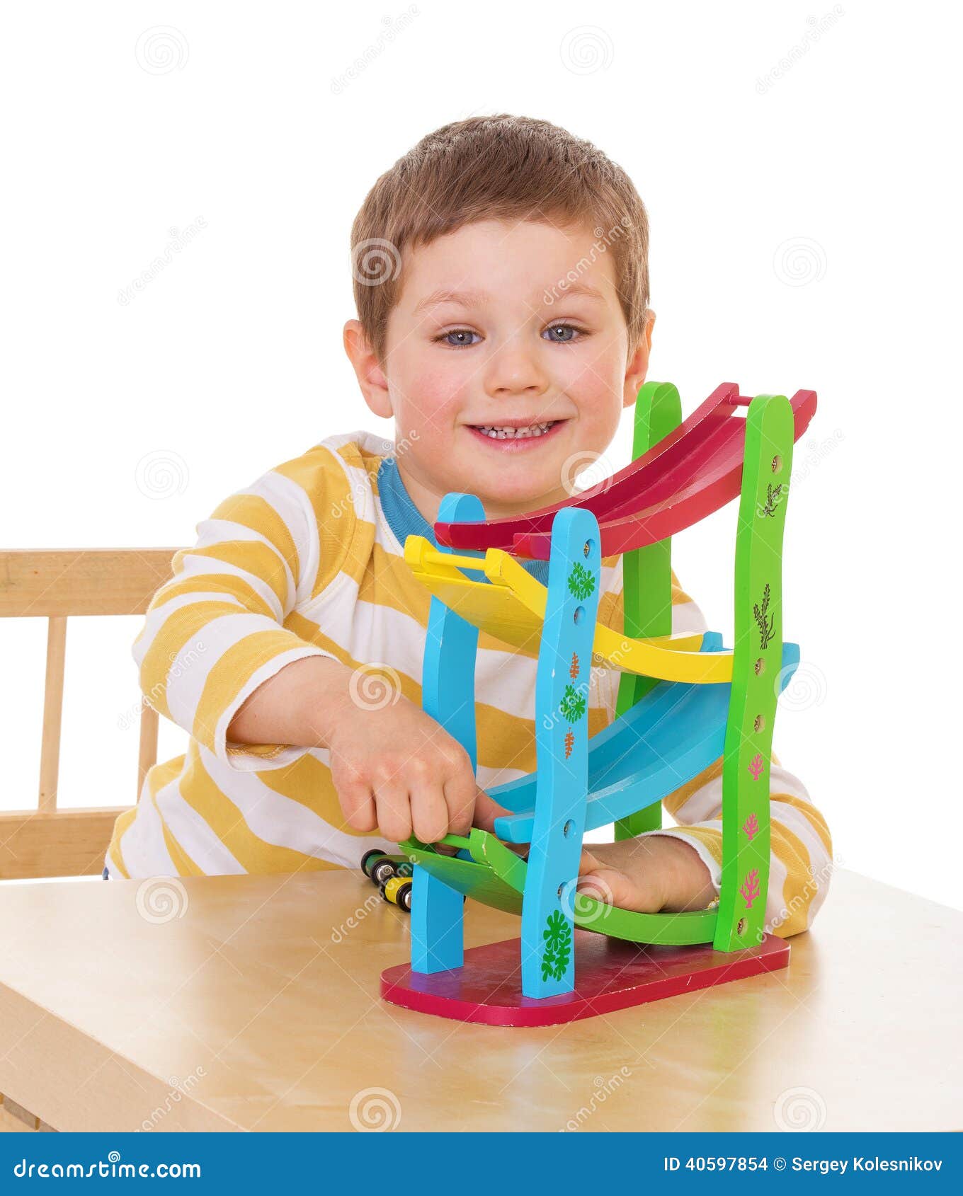 Little Boy Playing at the Table Stock Photo - Image of color, male ...