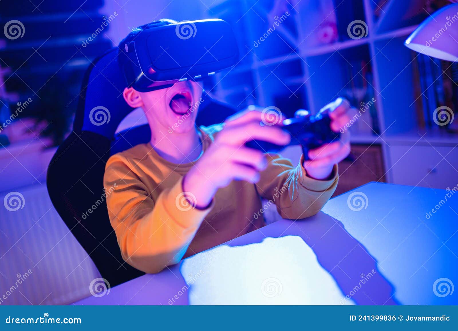 Boy Playing Video Game Using Vr Glasses in the Dark Room Stock Photo ...