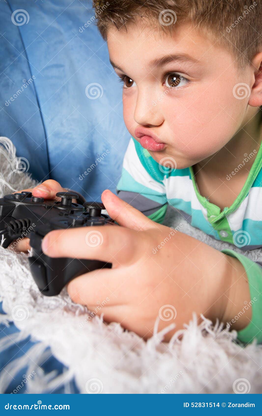 Little Boy Playing Video Games Stock Photo - Image of emotion, playful ...