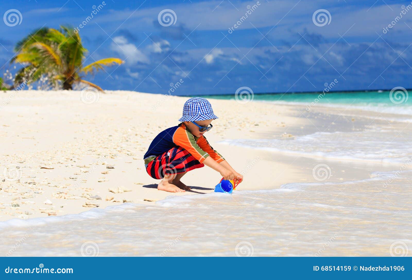 Little Boy Playing with Water on Beach Stock Image - Image of childhood ...