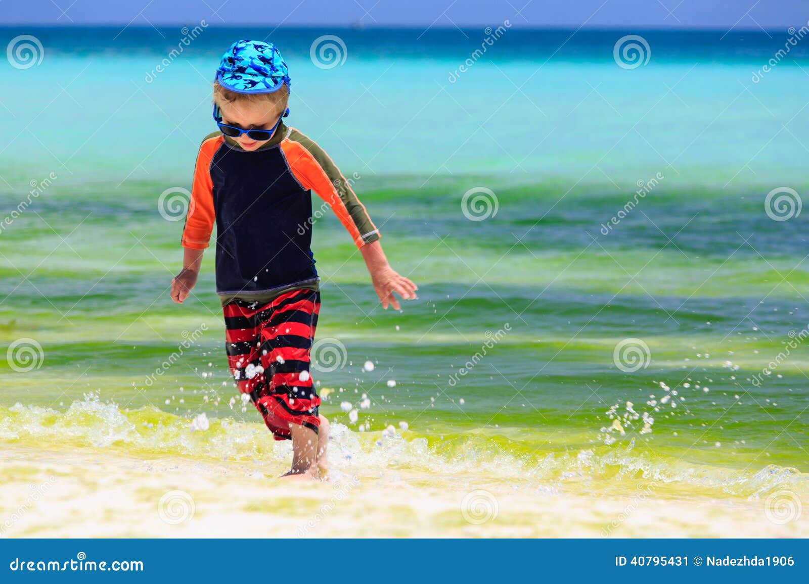 Little Boy Playing with Water on the Beach Stock Image - Image of ...