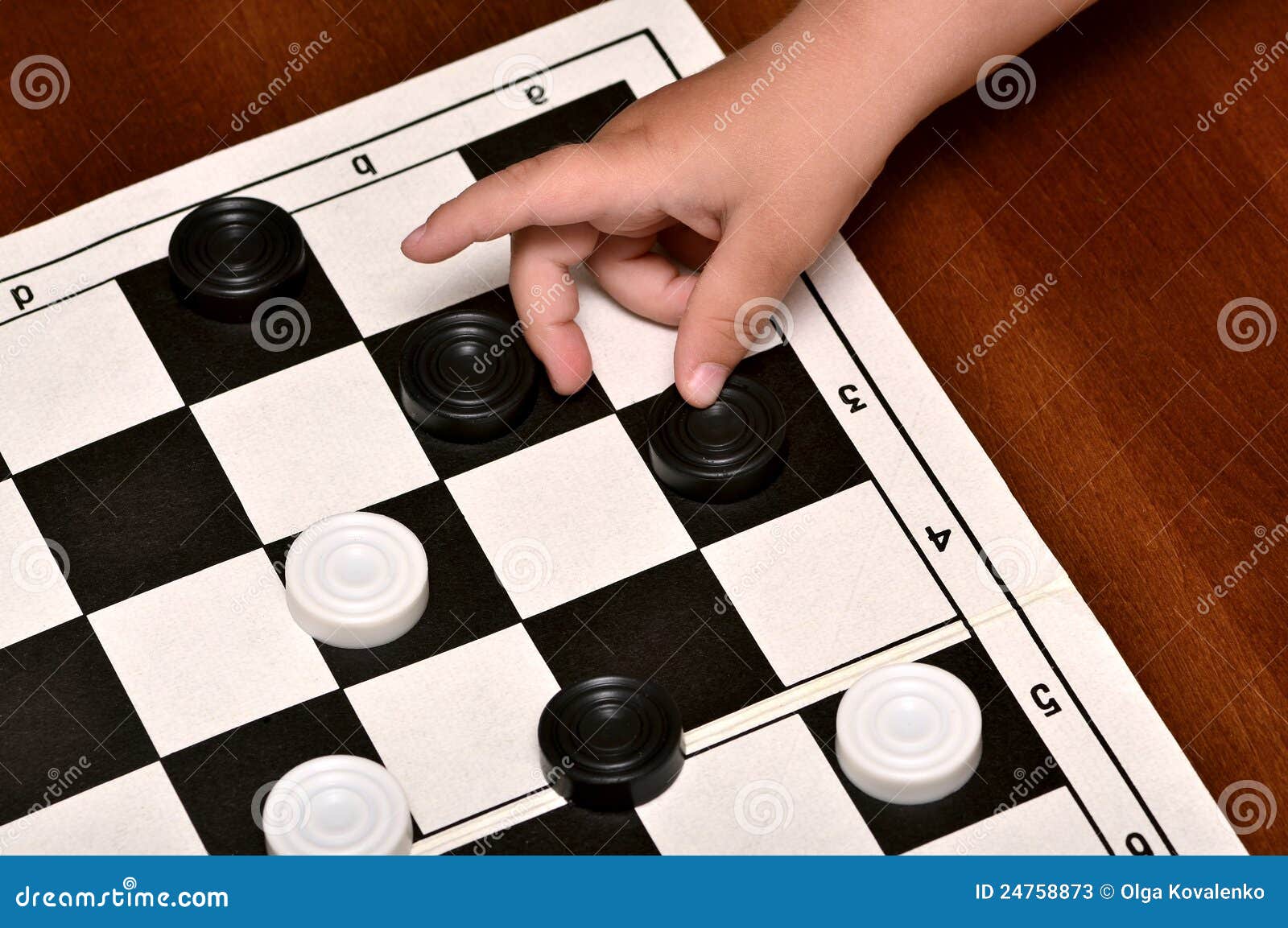 Little boy plays checkers stock image. Image of activity - 24758873
