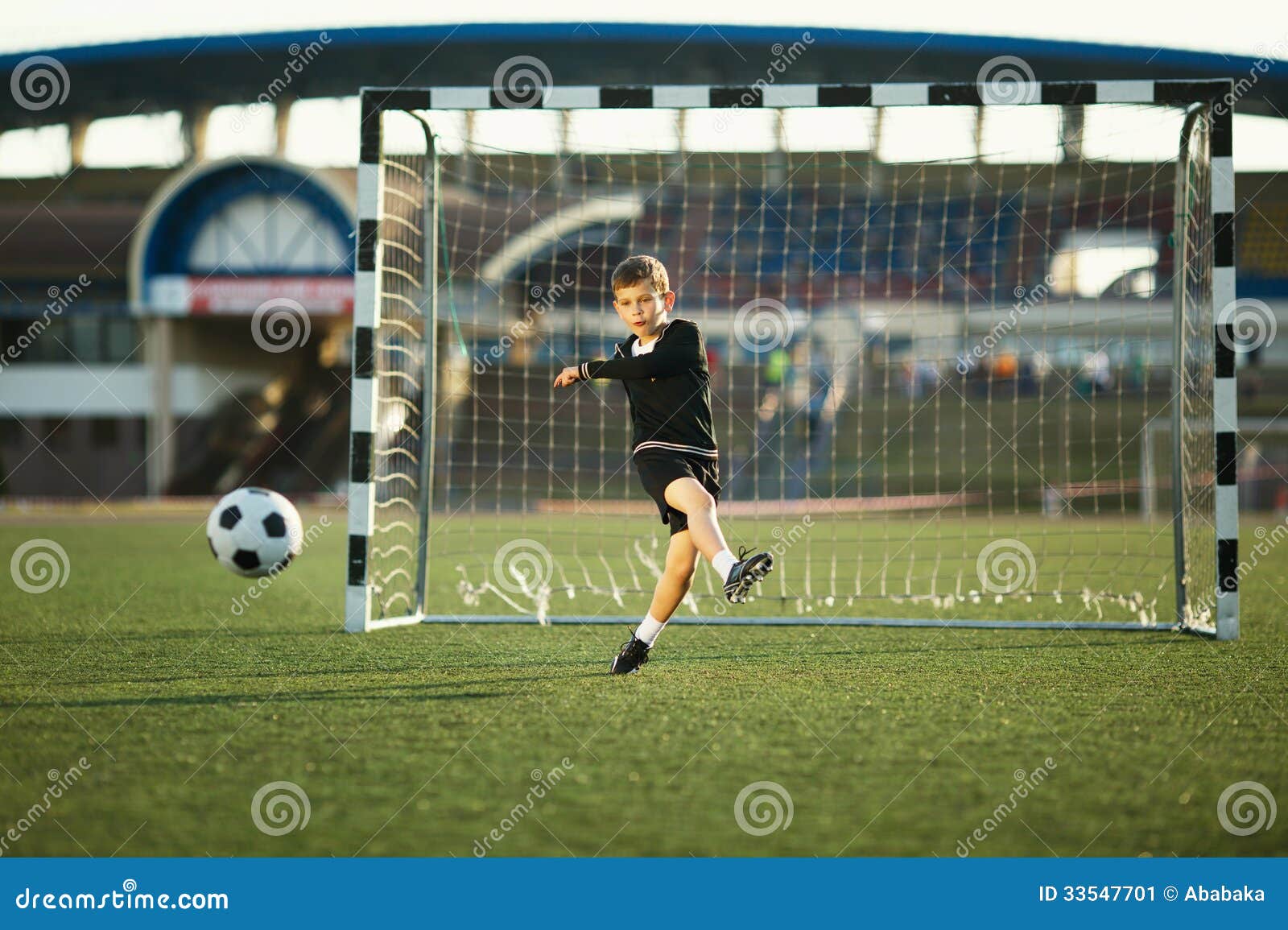 Little boy plays football stock image. Image of male - 33547701