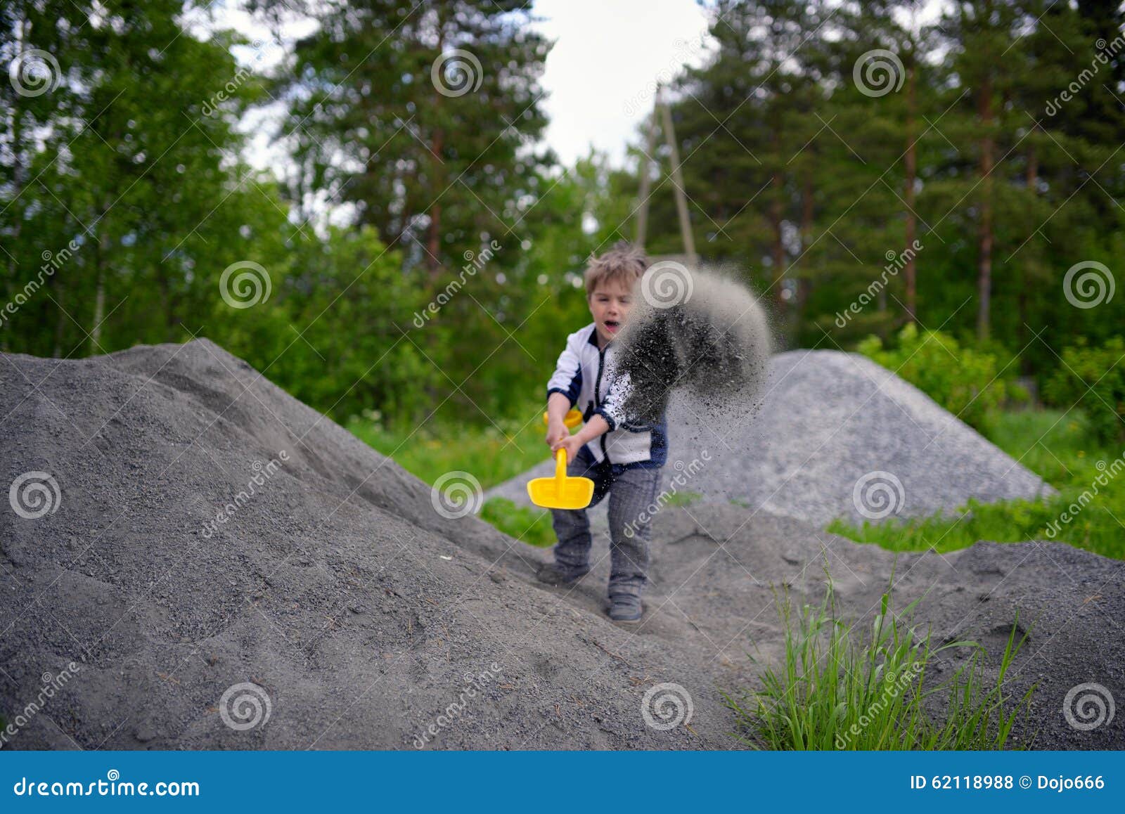 Little Boy Plays on Heap of Crushed Stone Stock Photo - Image of field ...