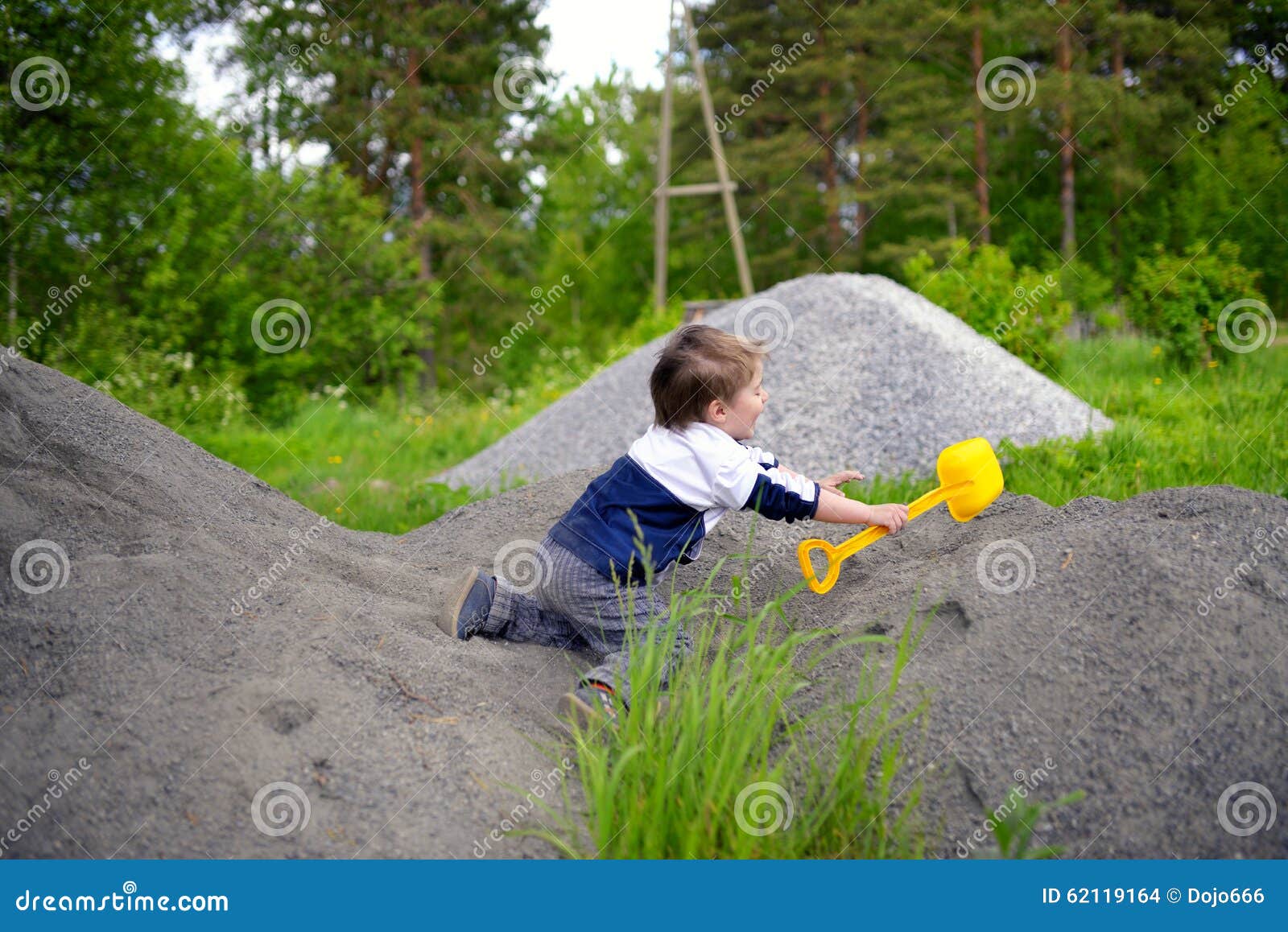 Little Boy Plays on Heap of Crushed Stone Stock Photo - Image of ...